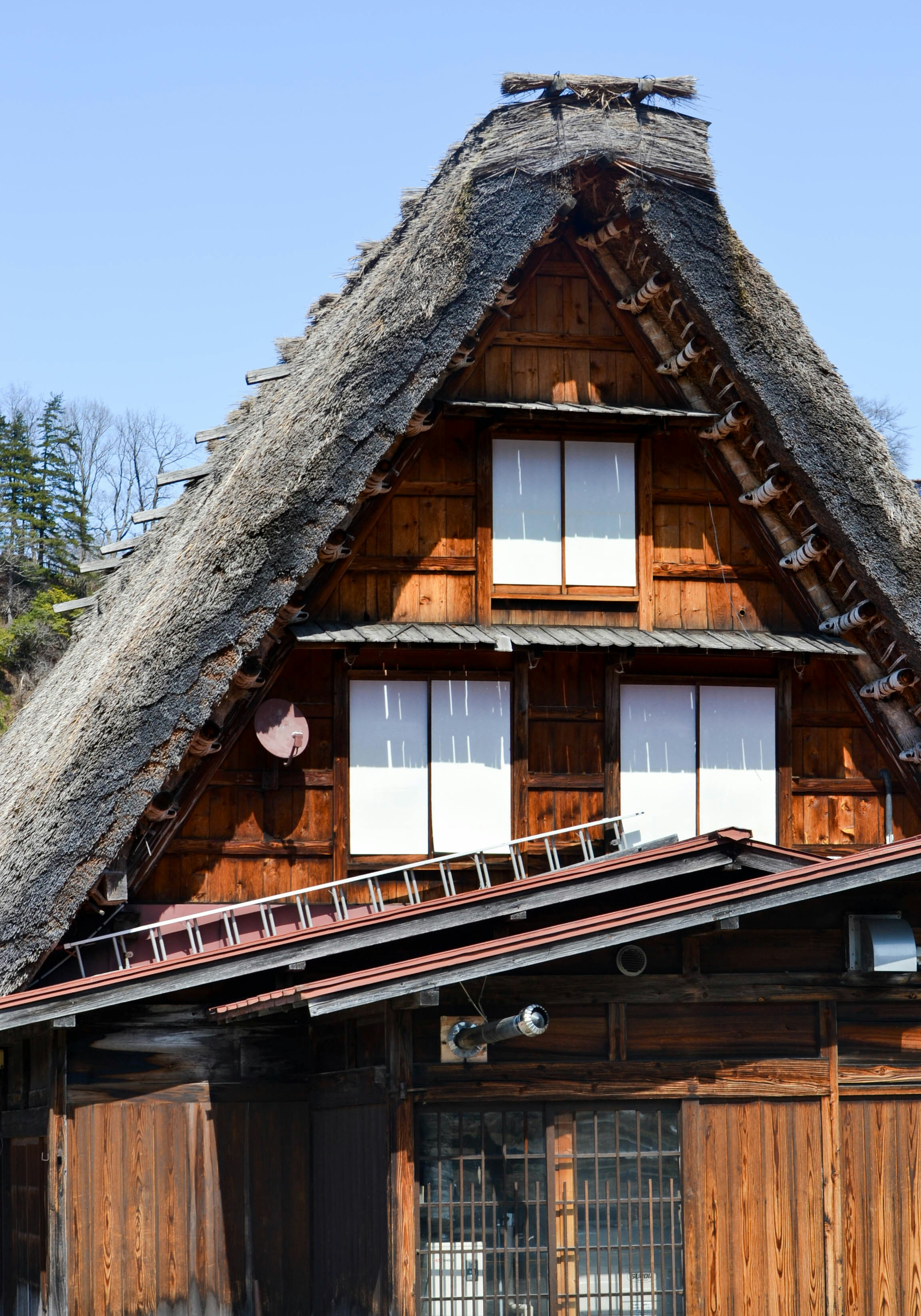Thatched A-Frame Charm: Wooden Facade and Steam of Time