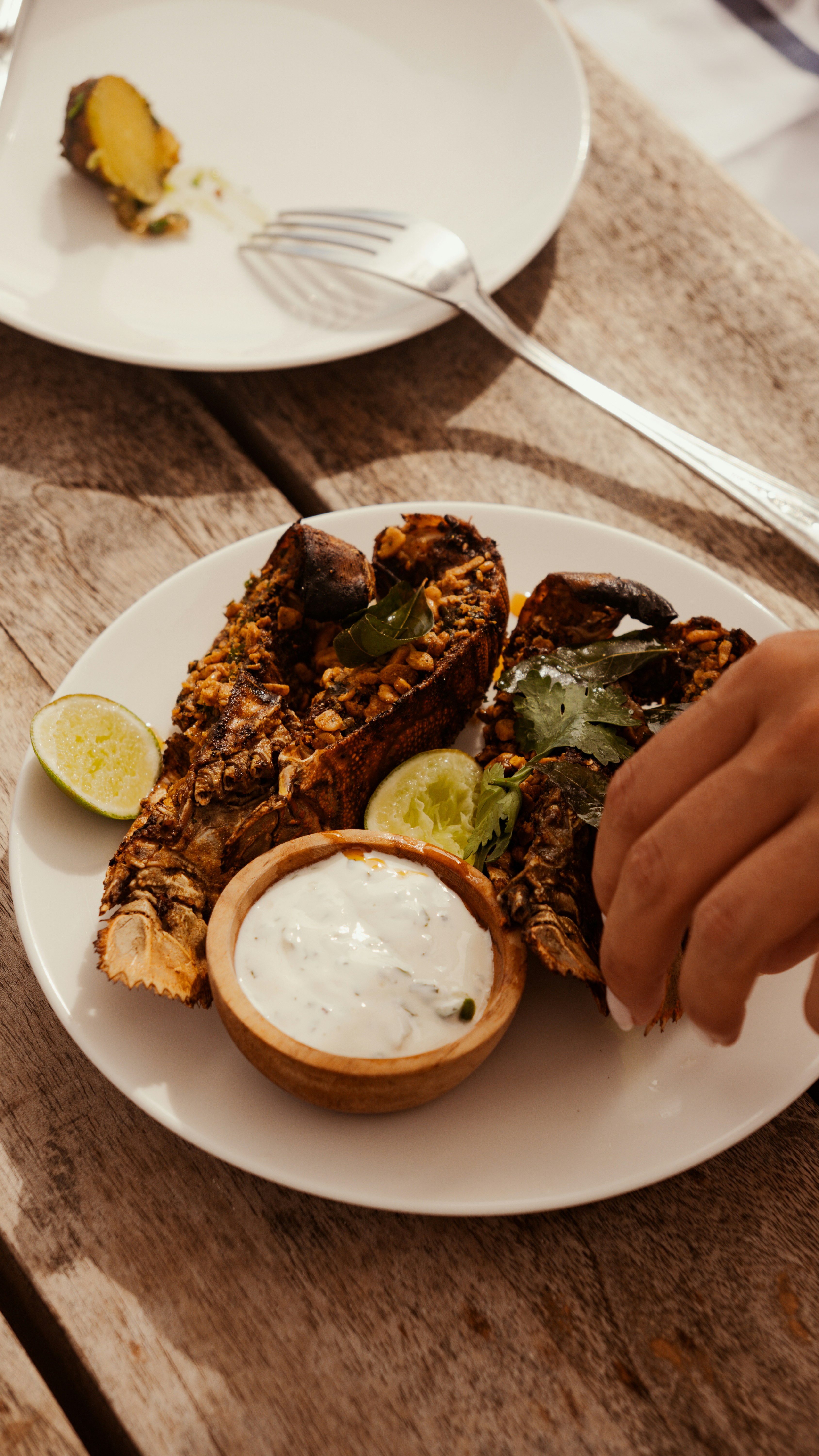 Charred Fish with Lime and Herb Relish on a Rustic Wooden Table