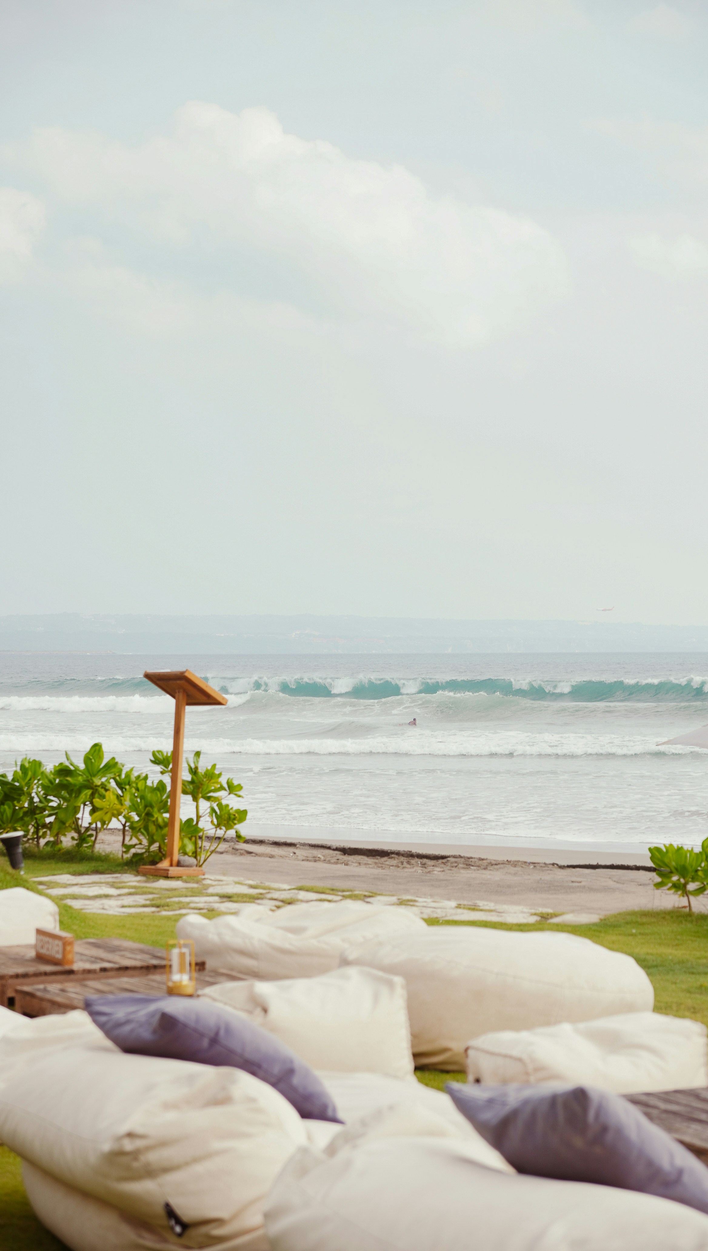 Seaside Lounge: Cushions, Beach Grass, and Gentle Waves