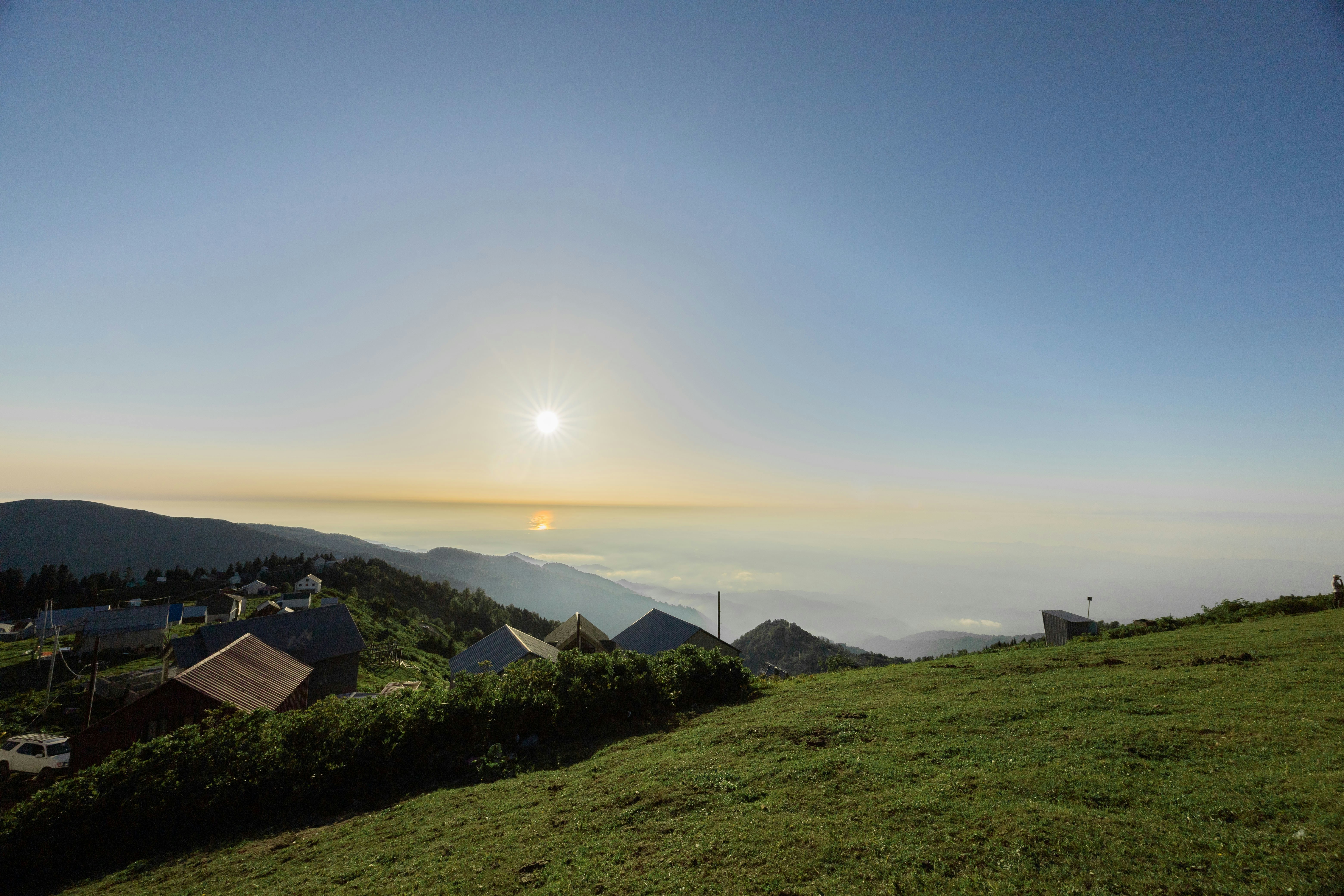 Sunlit Plateau Over Ocean Fog: A Quiet Horizon