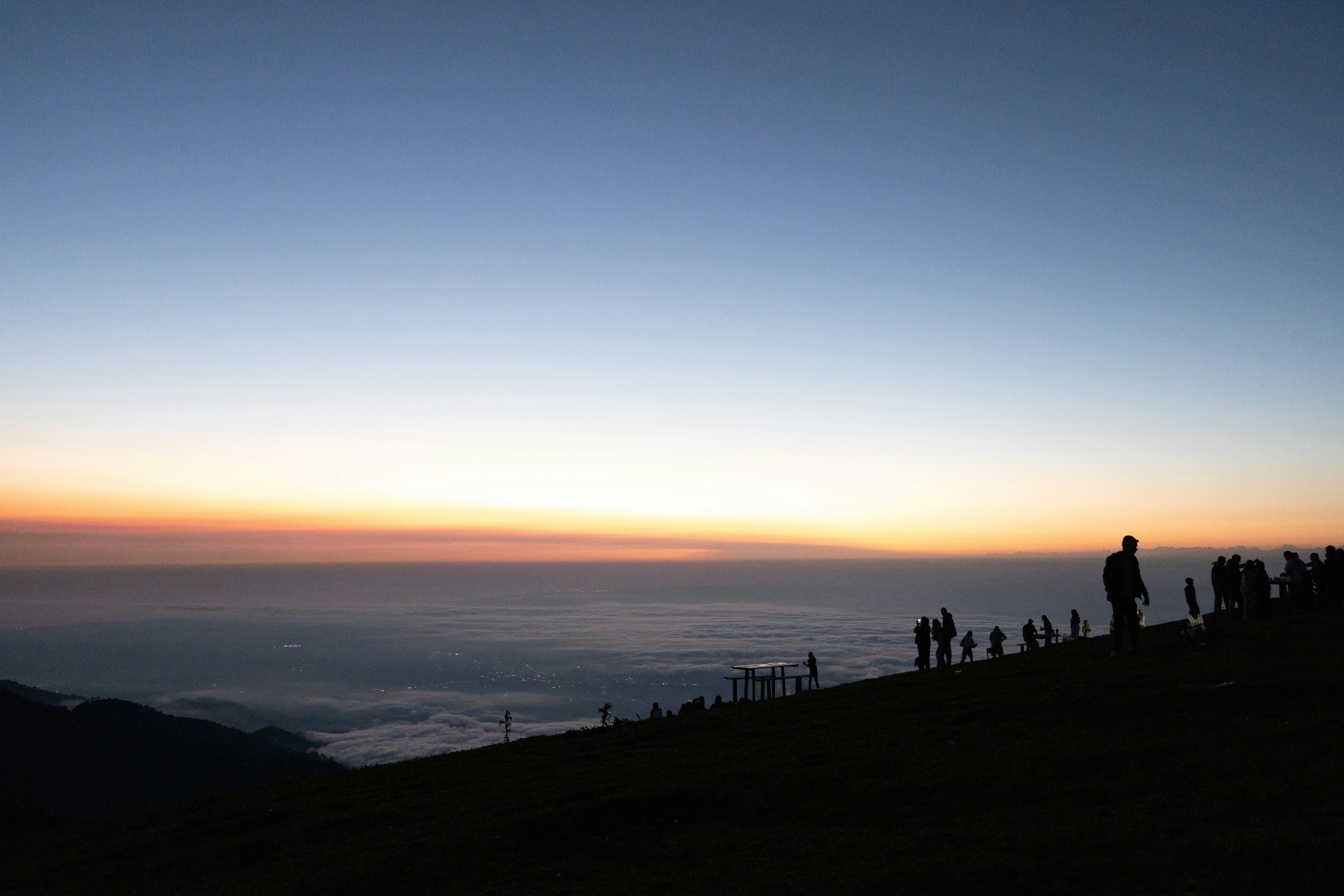 Sunset Summit: silhouettes at the edge of the world