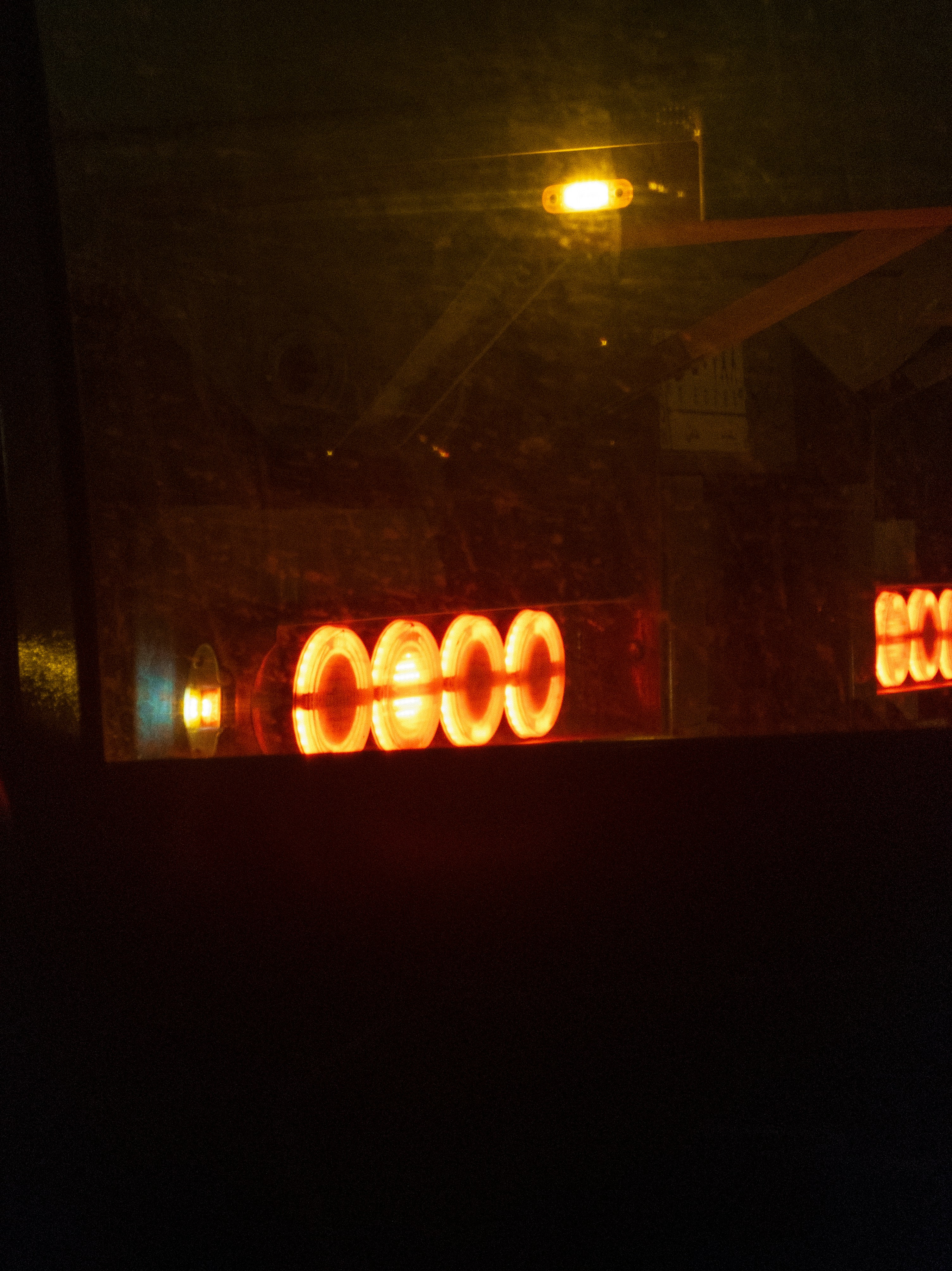 Neon Ring Echoes in a Night Window
