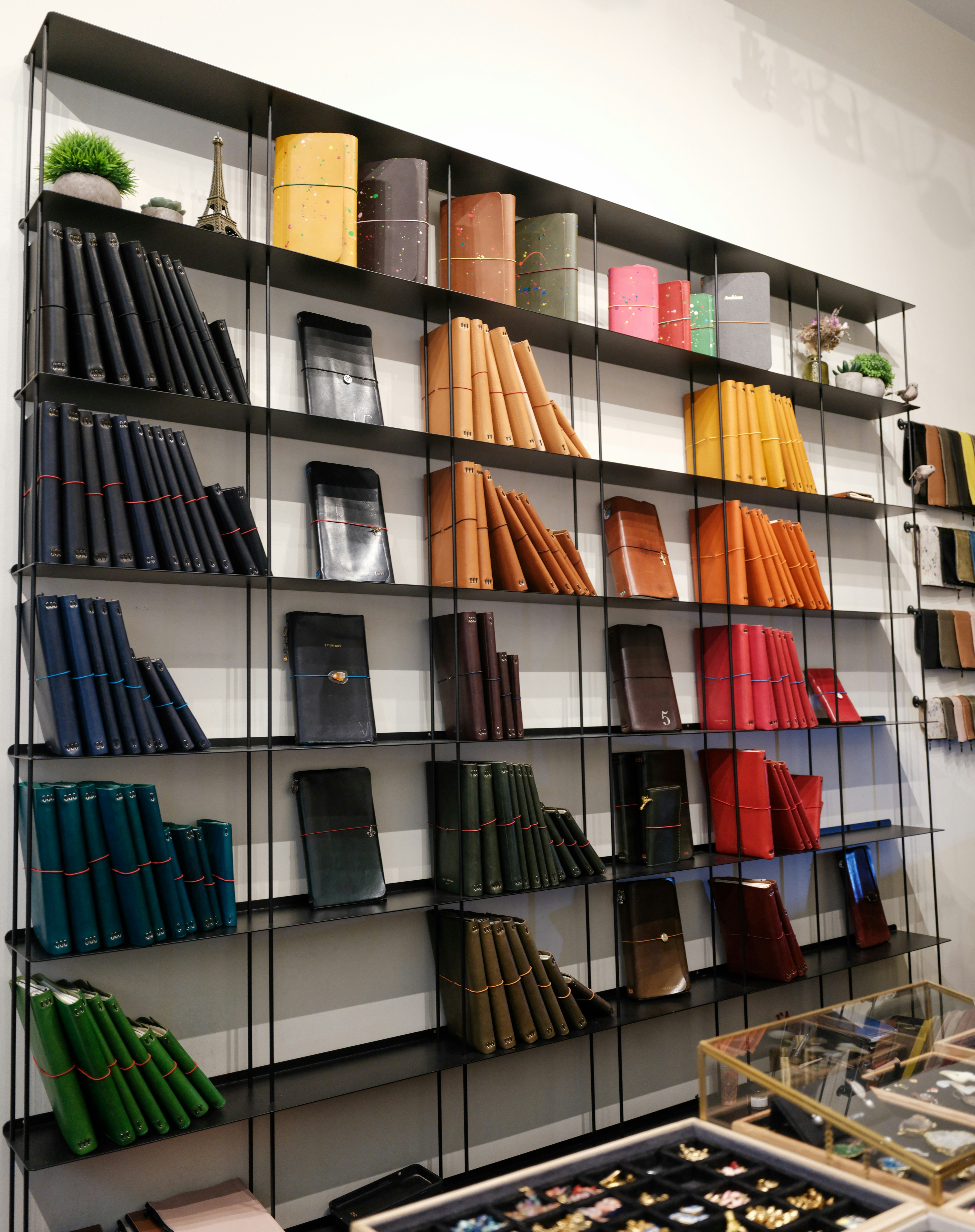 Colorful Shelf Symphony: An Array of Journals and Notebooks