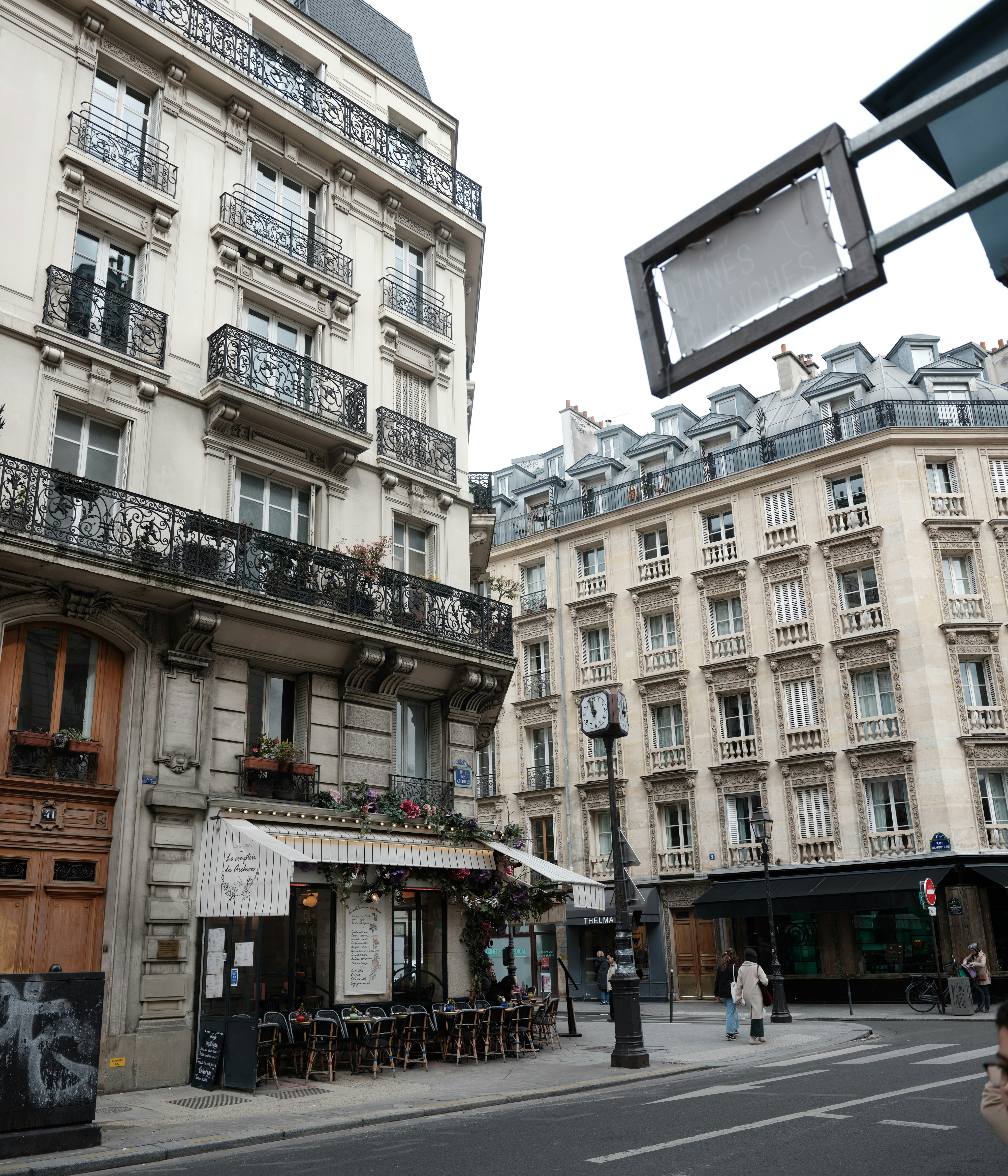 Parisian Streetfront: Cafés, Facades, and Quiet Evening Foot Traffic