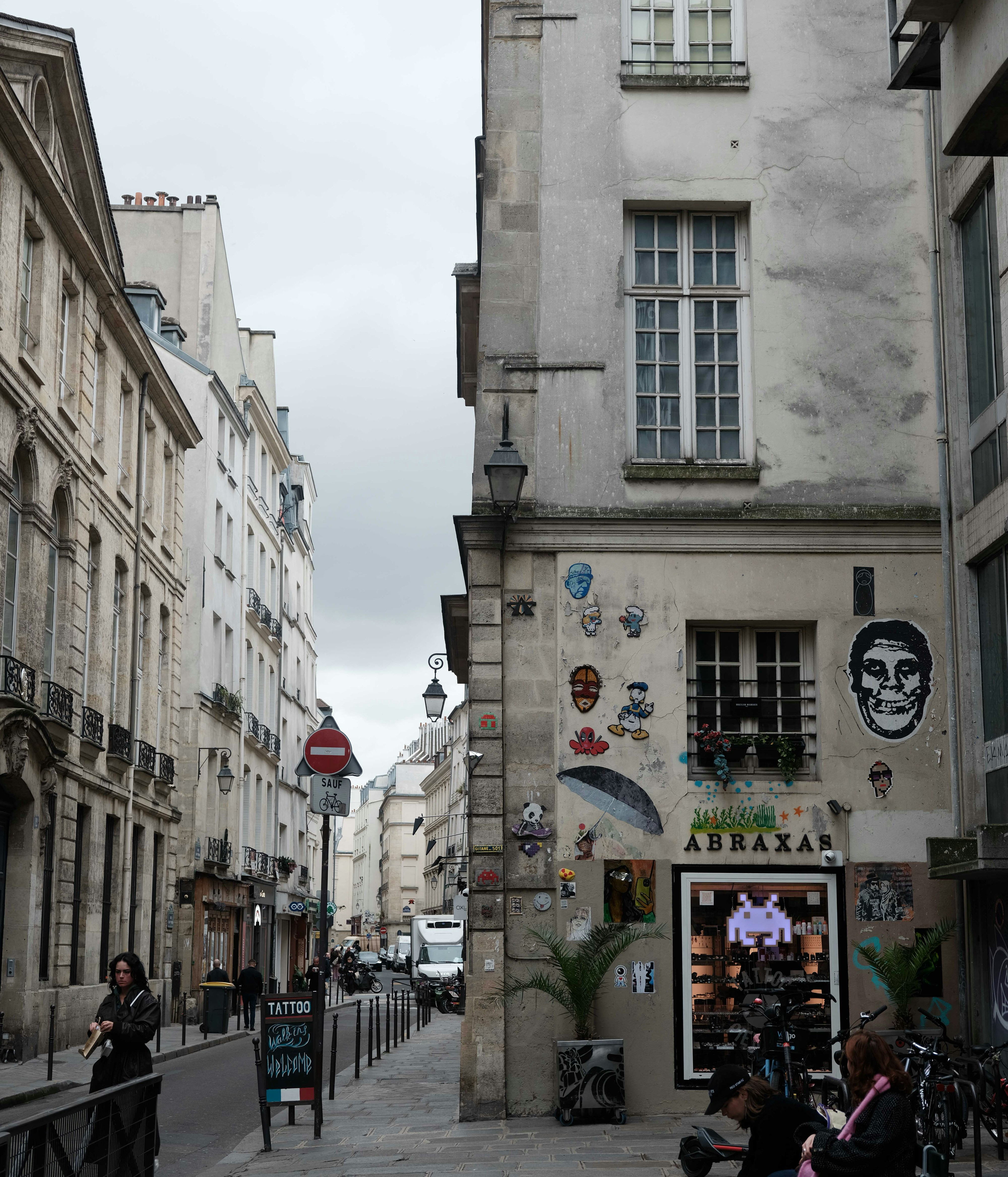 Street Narrow in Paris: Walls of Graffiti and a Shopfront Story