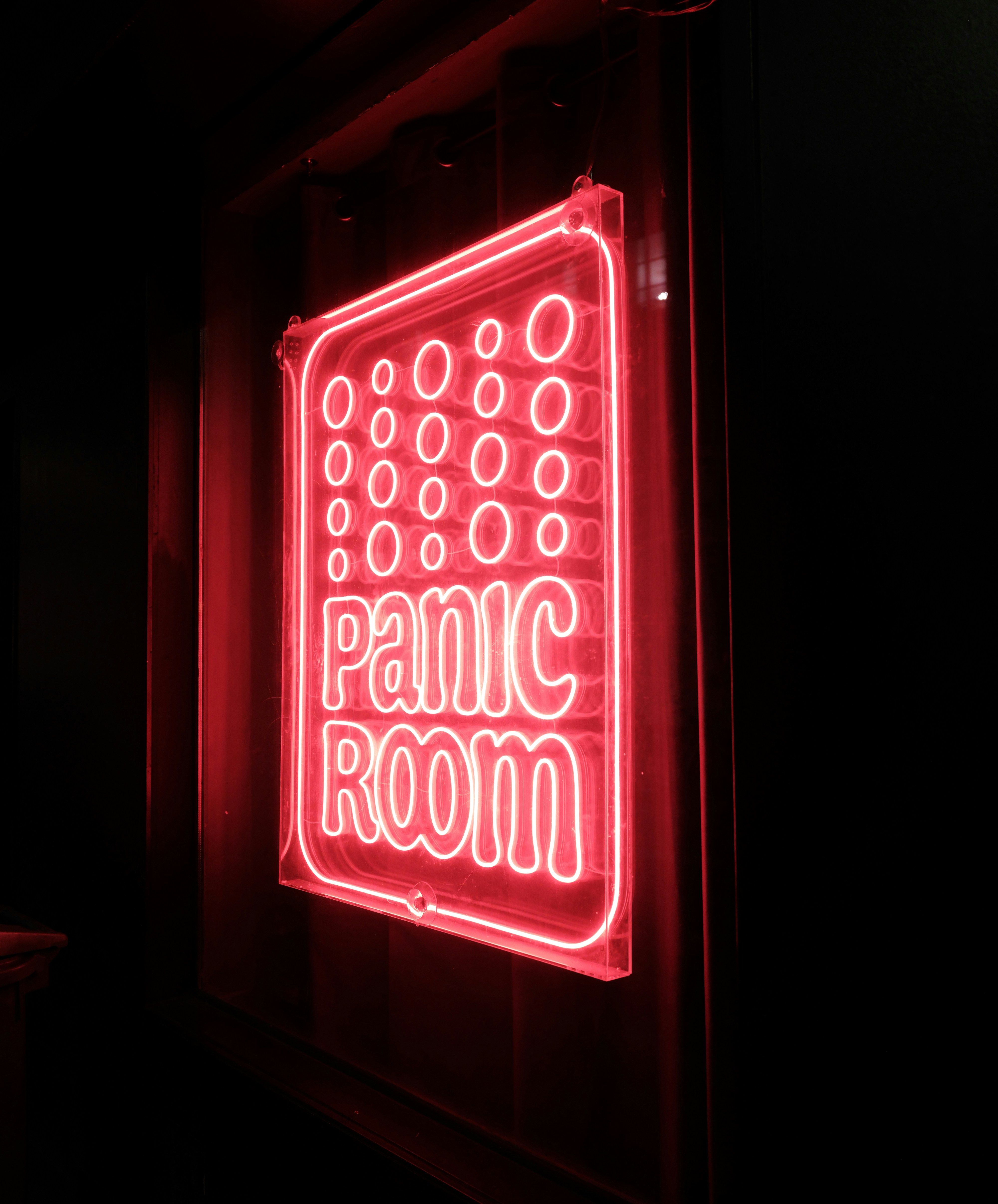 Neon Panic: A Crimson Sign Illuminating the Dark