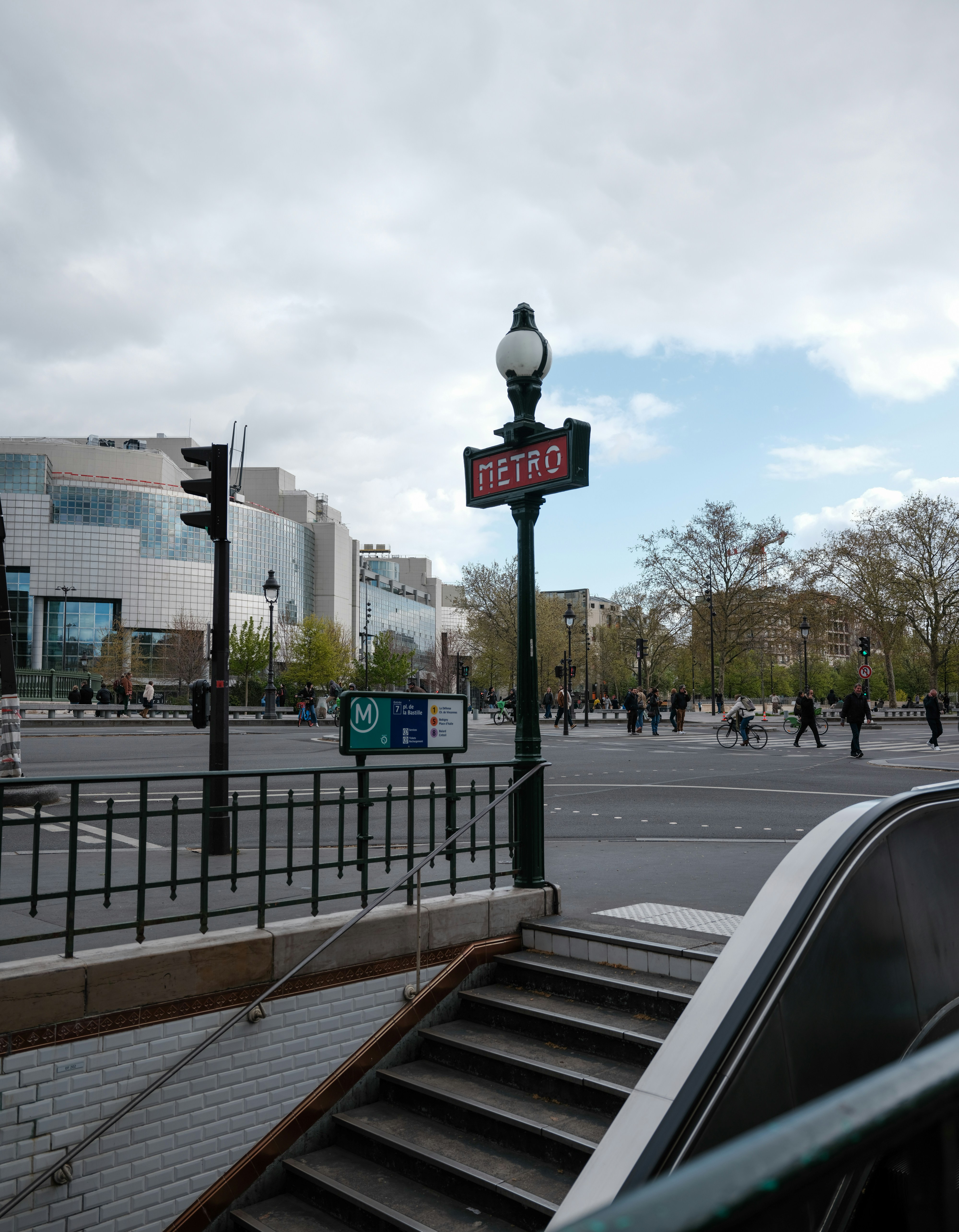 Metro Sign and Lamppost Anchoring a City Square
