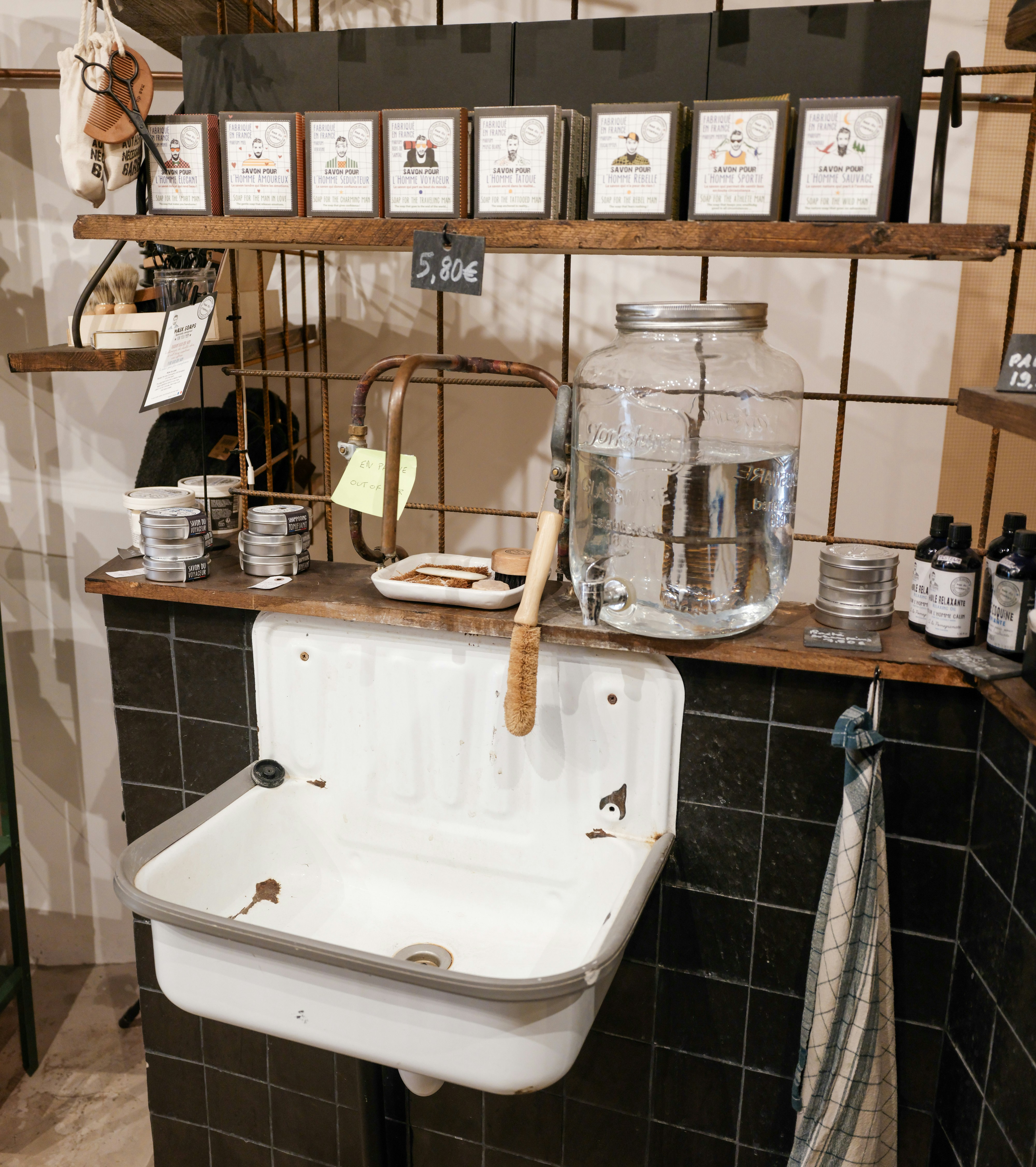 Vintage Sink Corner: Mason Jar and Copper Rail in a Rustic Café Setup