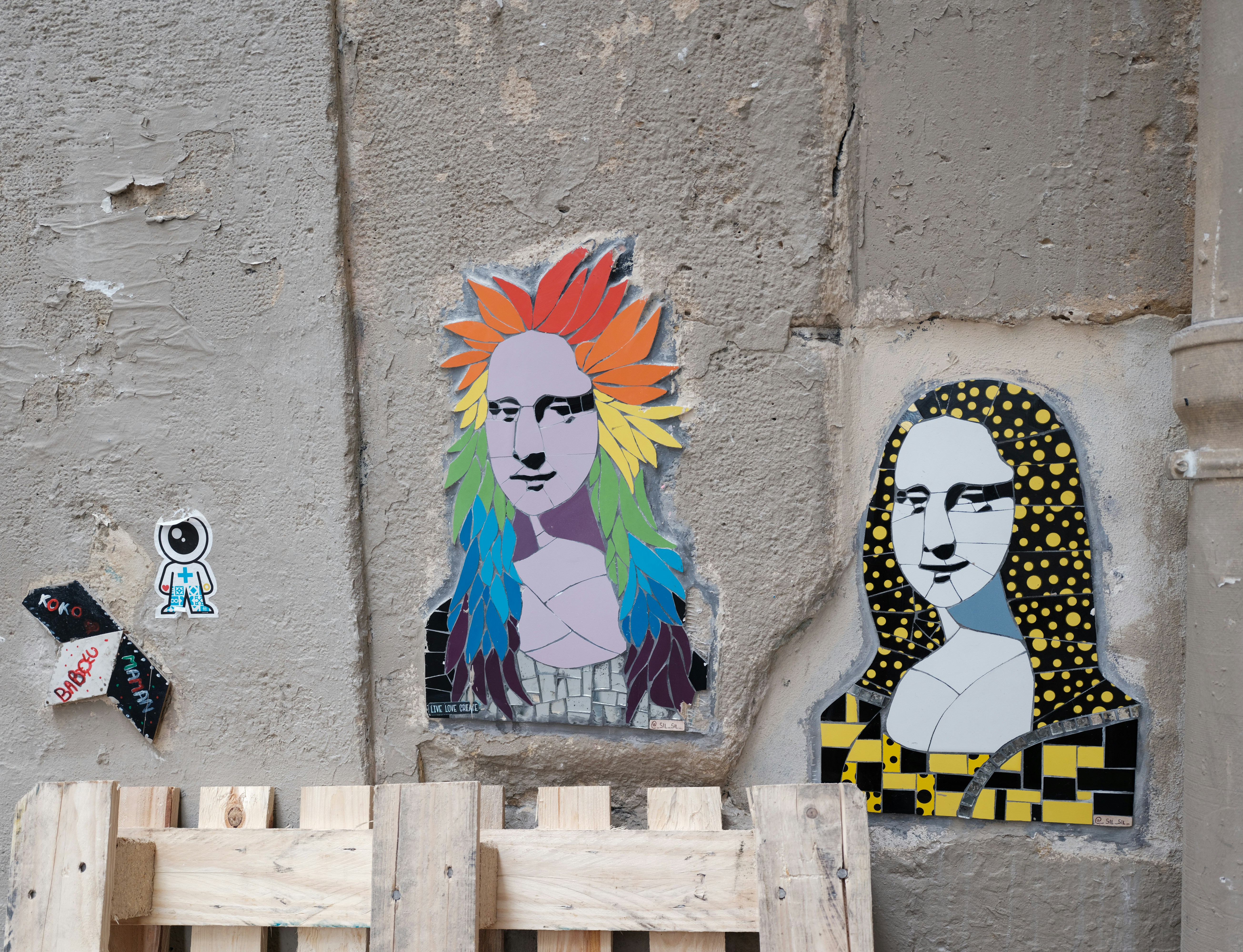 Rainbowed Voices on a Crumbling Wall
