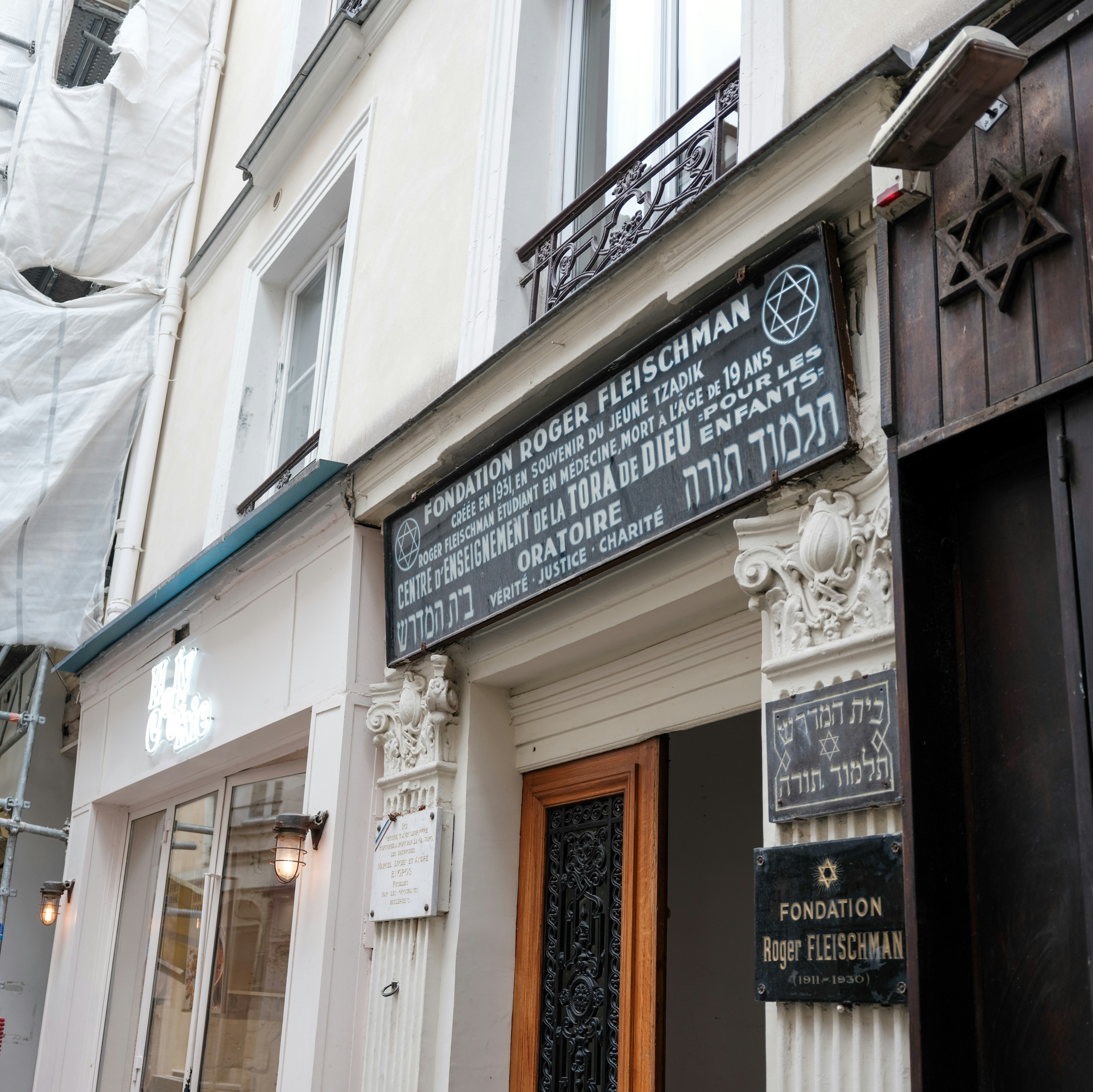 Blue Plaque and Ornate Entrance of a Historical Foundation