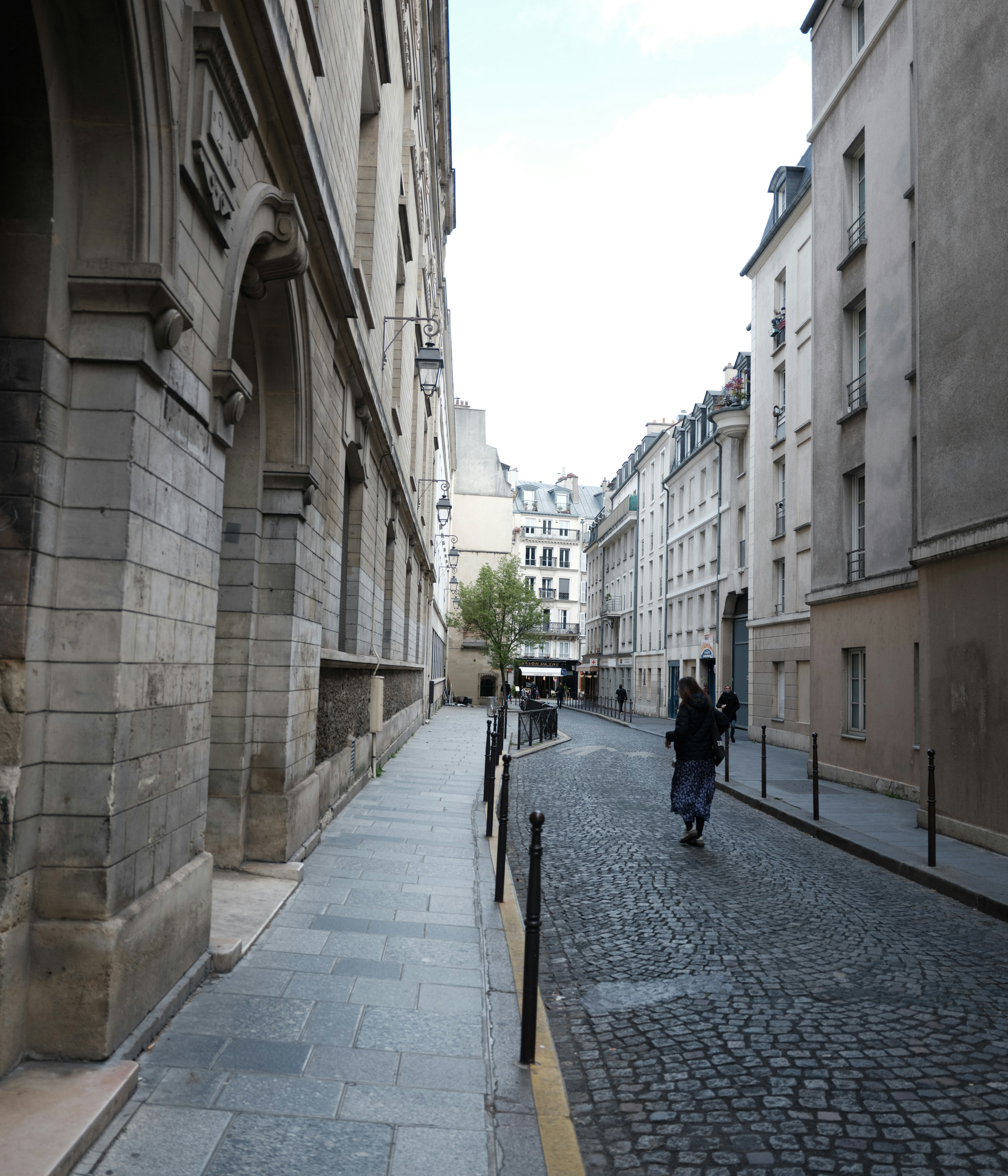 A Quiet Parisian Lane with Cobblestones and Echoes of Footsteps
