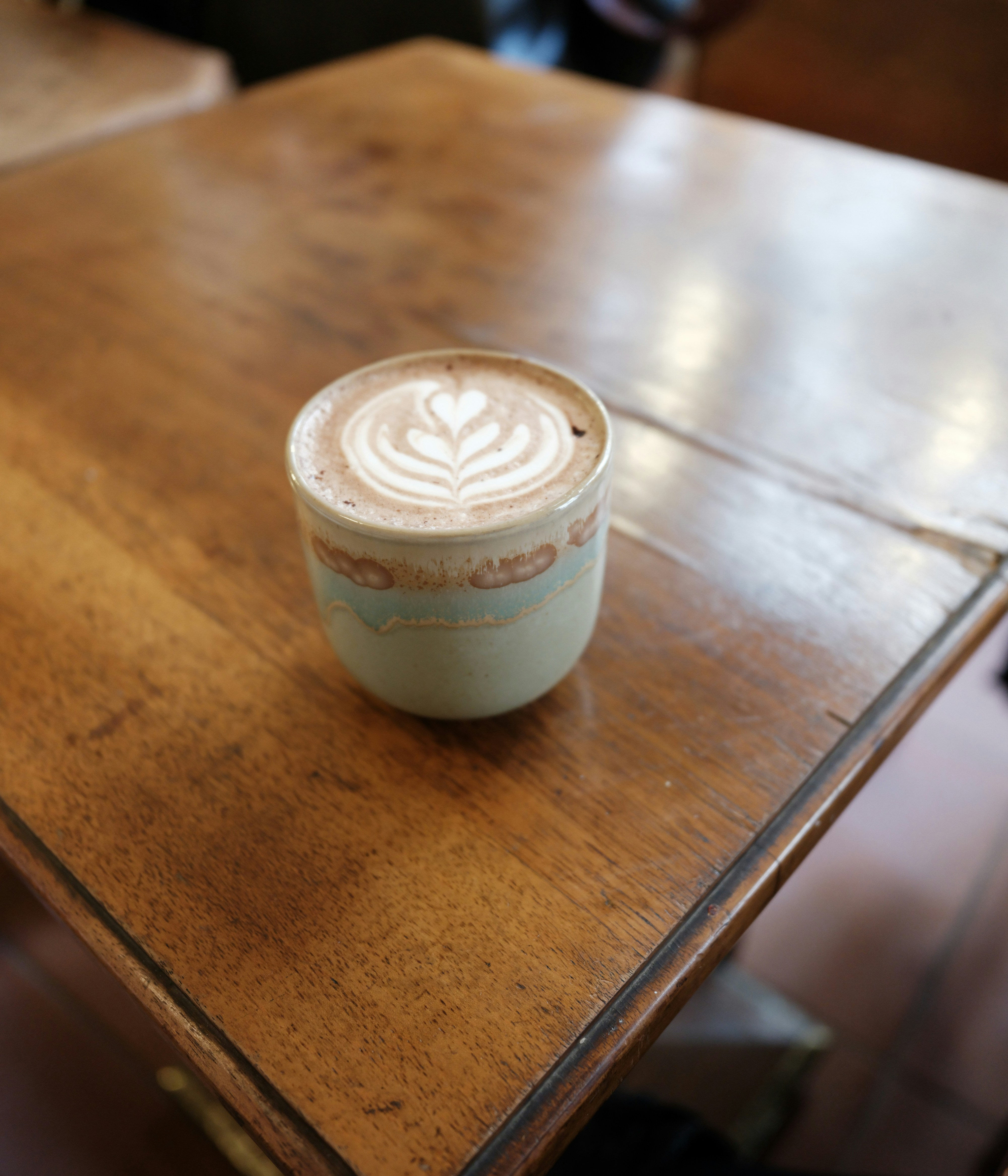Latte Leaf on a Wooden Table