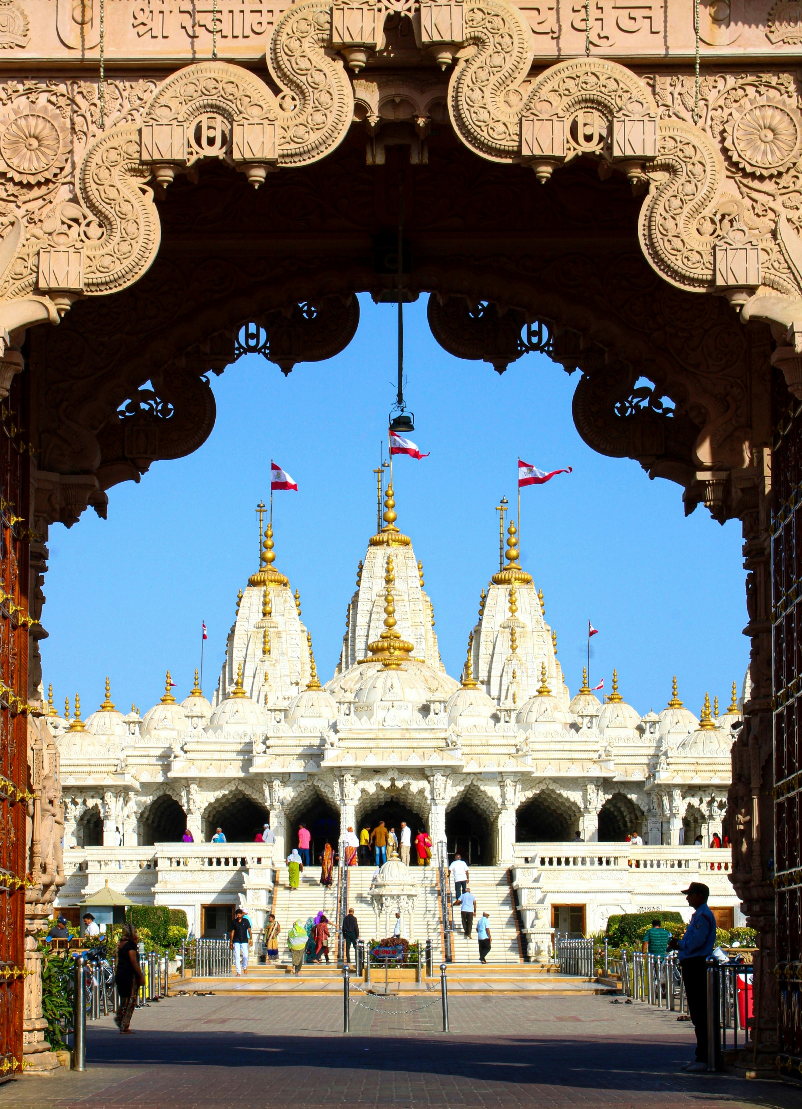 Ornate Gateway Framing a White Temple Summit