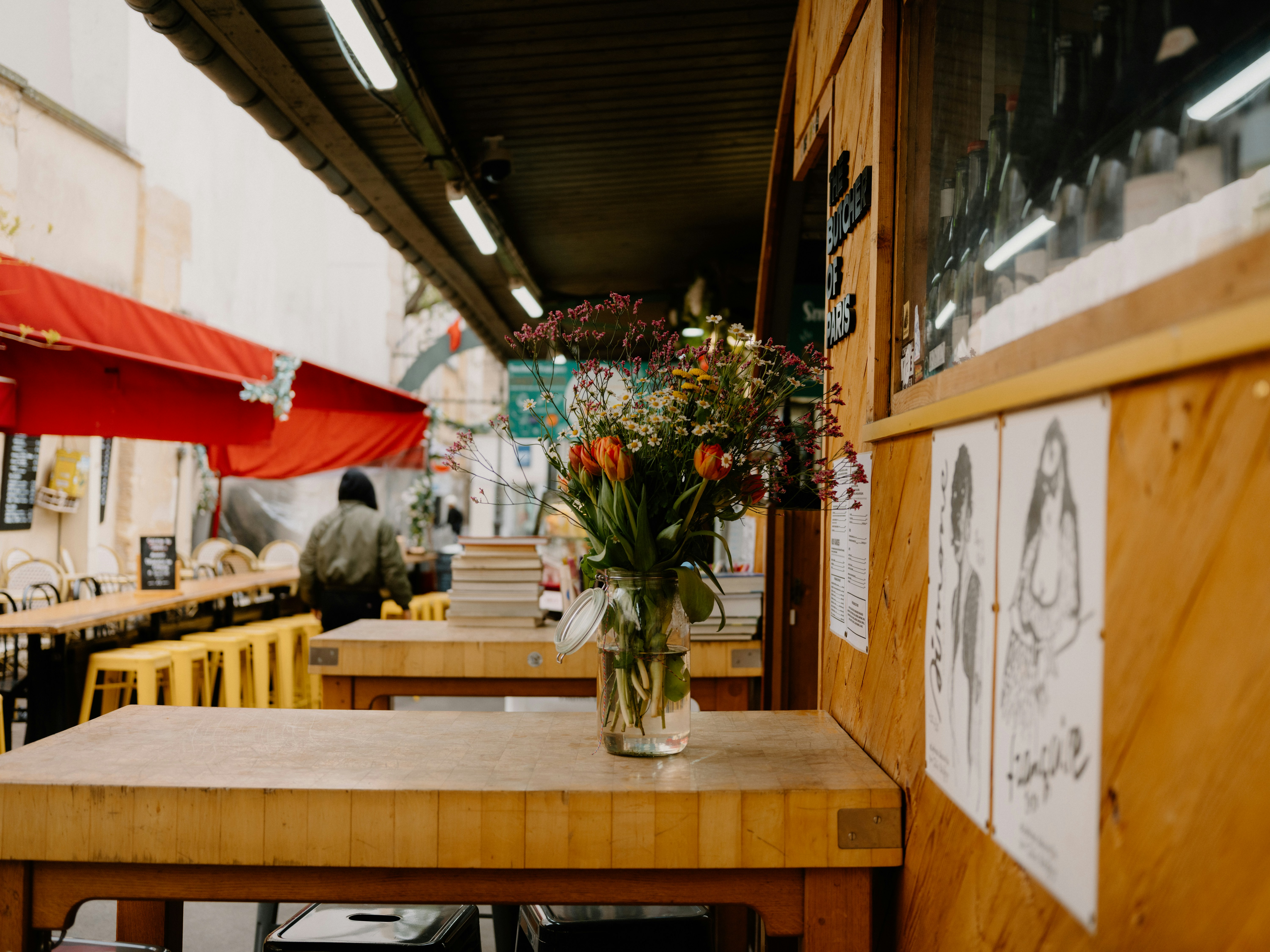 Sunlit Café Corner with Floral Still Life