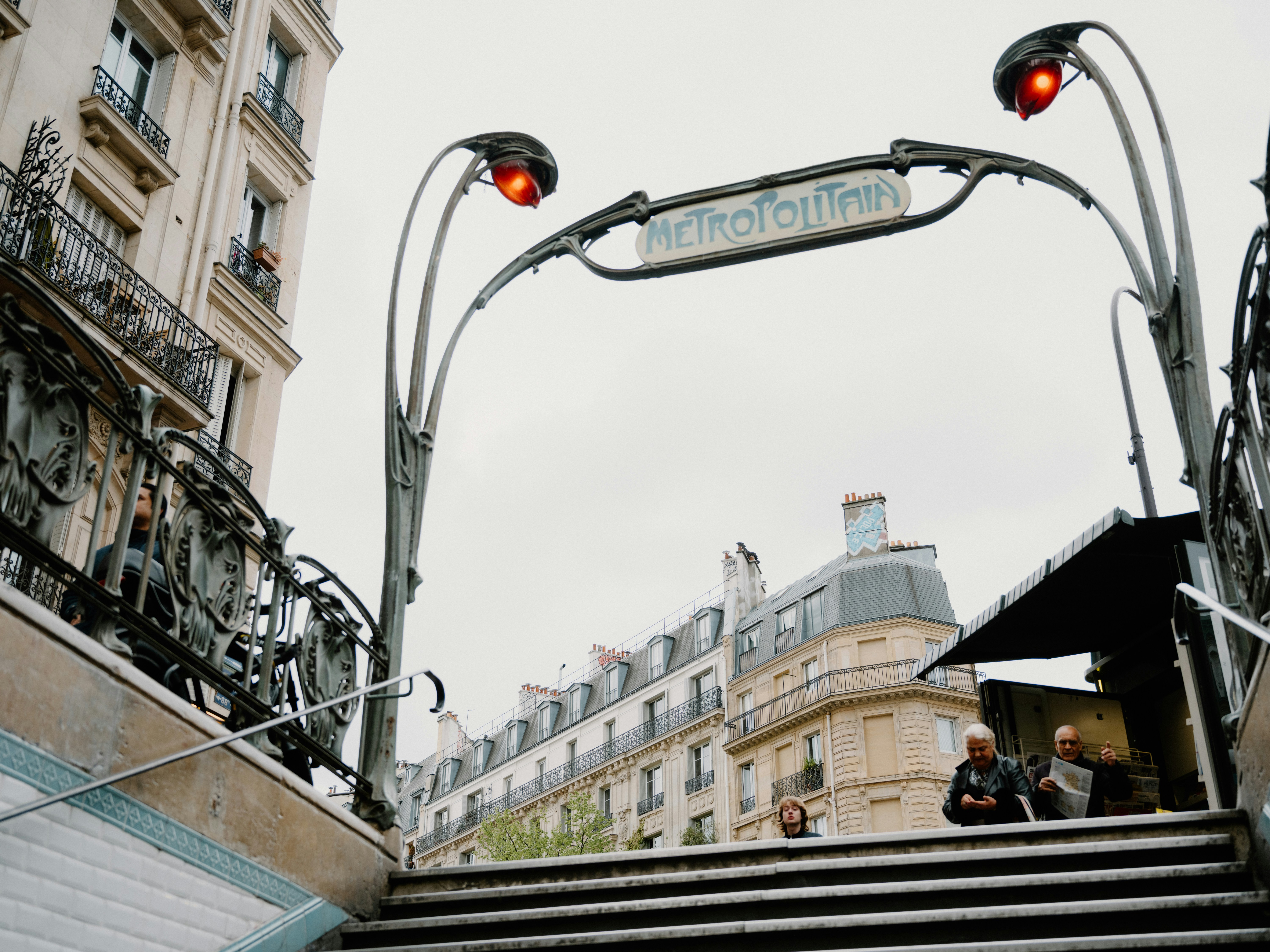 Metropolitan Arc: Stairs to the Metro under a Curved Art Nouveau Framework