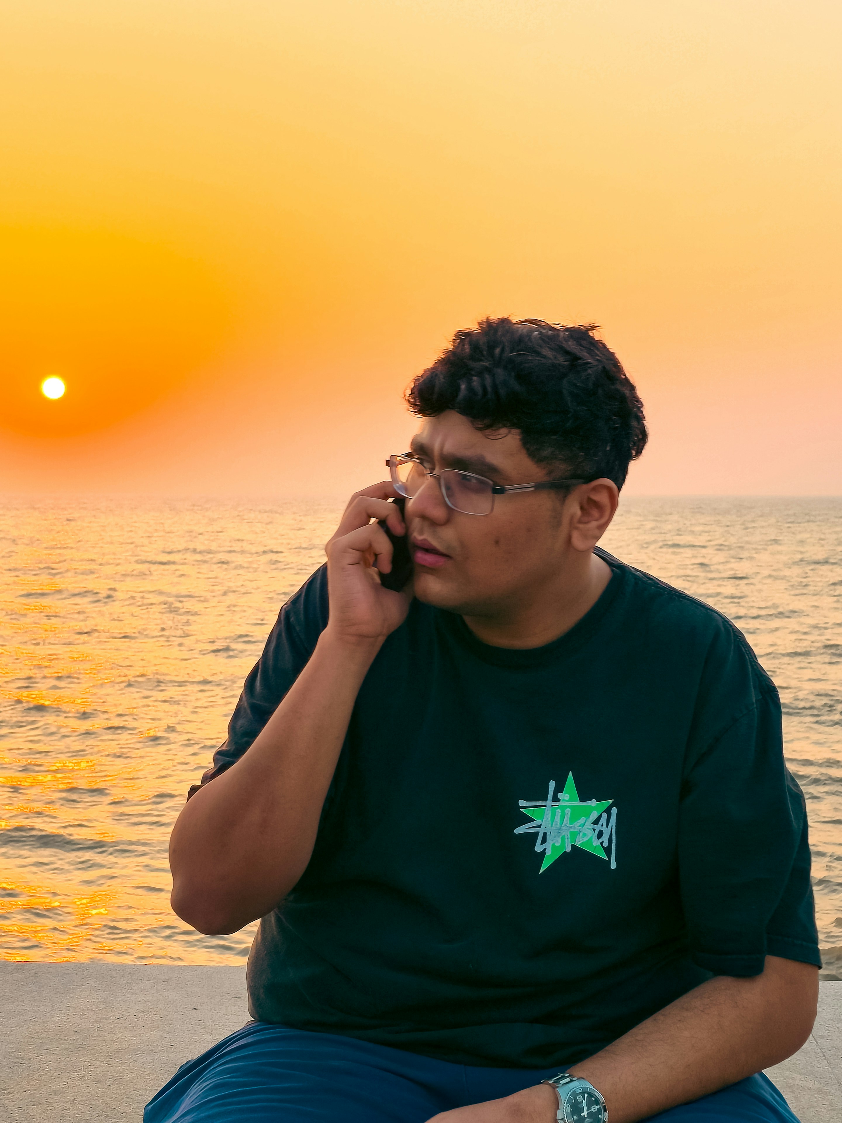 Sunset Call: A Seated Portrait by the Quiet Sea