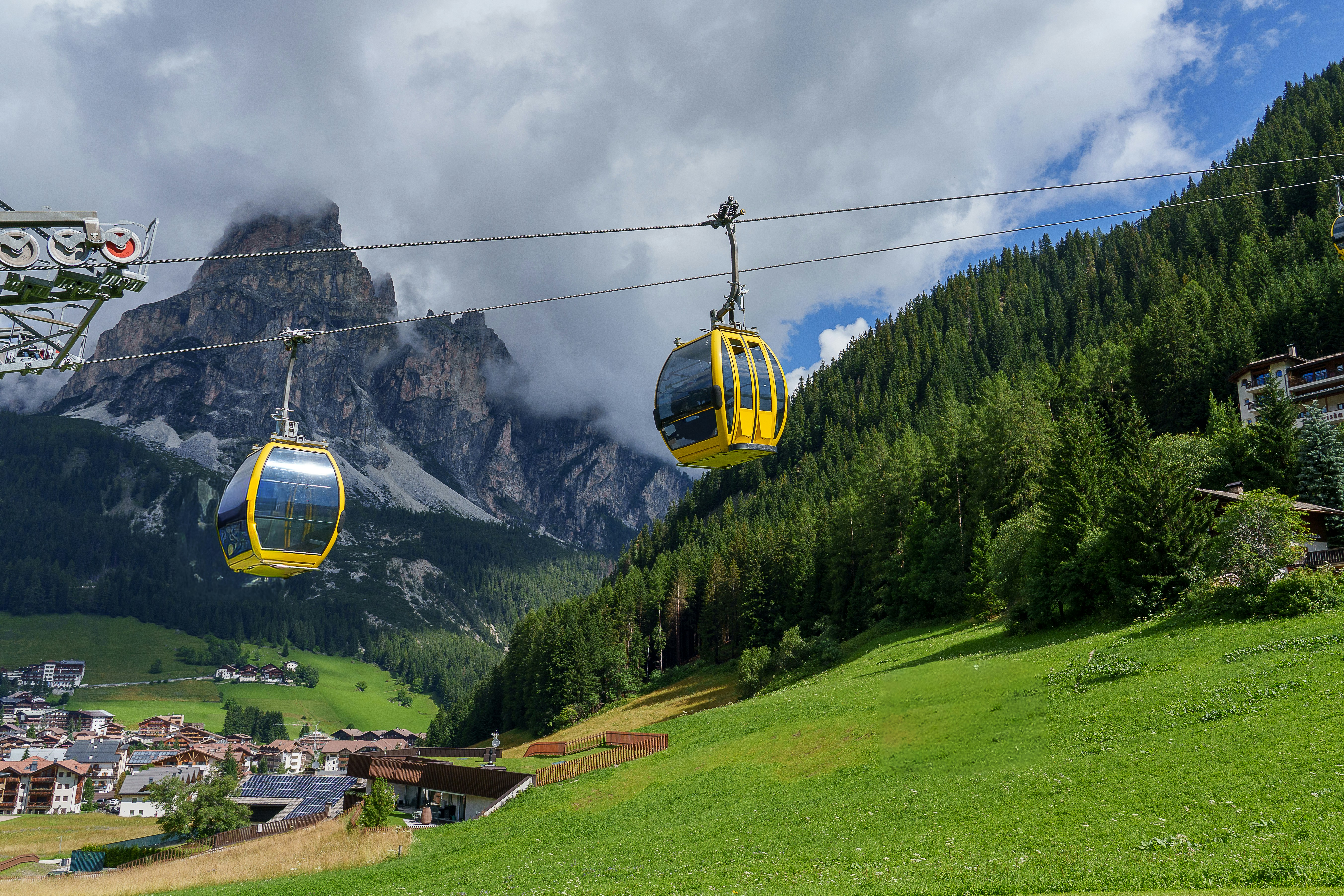 Cable Cars Over a Lush Alpine Valley