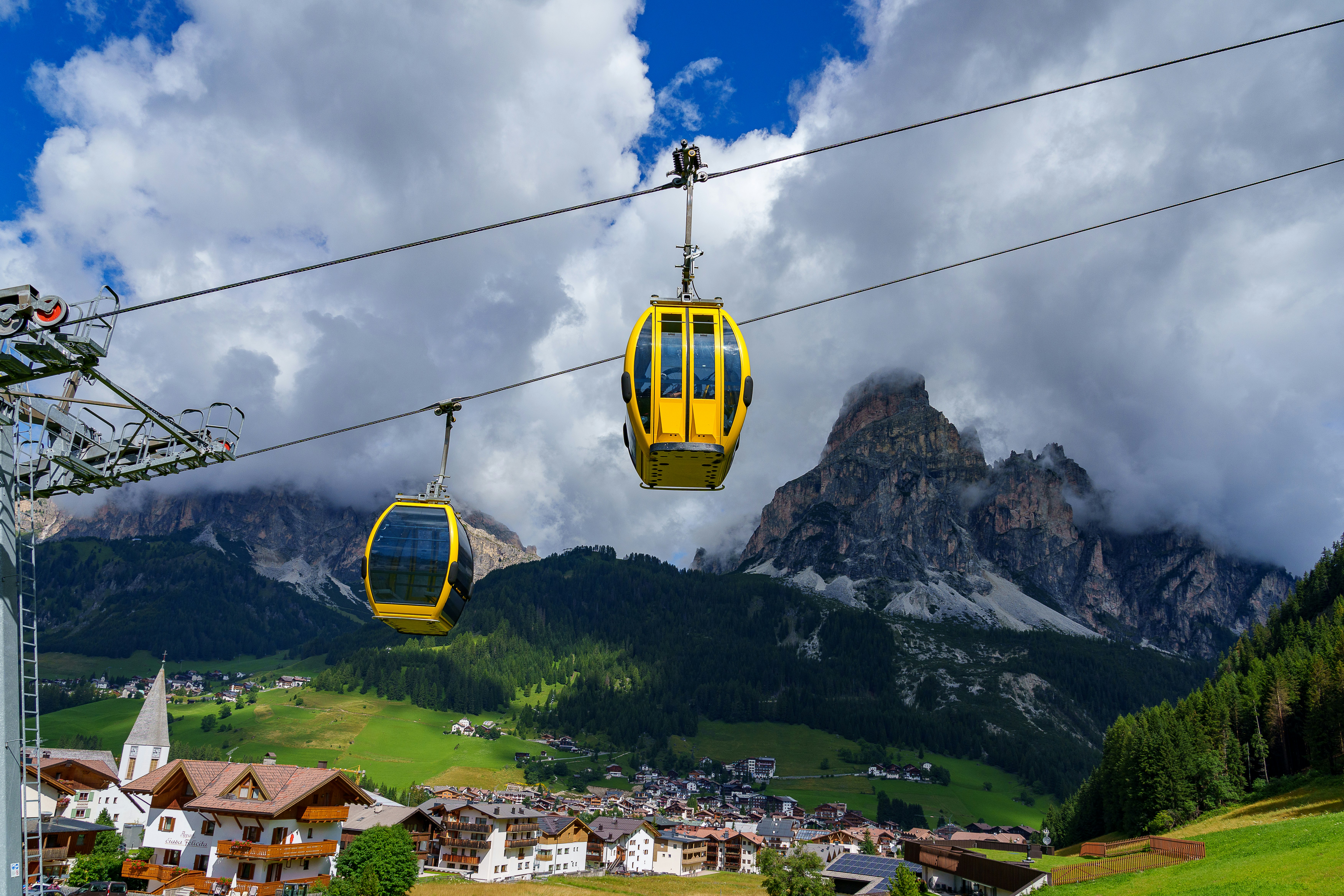 Gondola Lift Over a Alpine Village