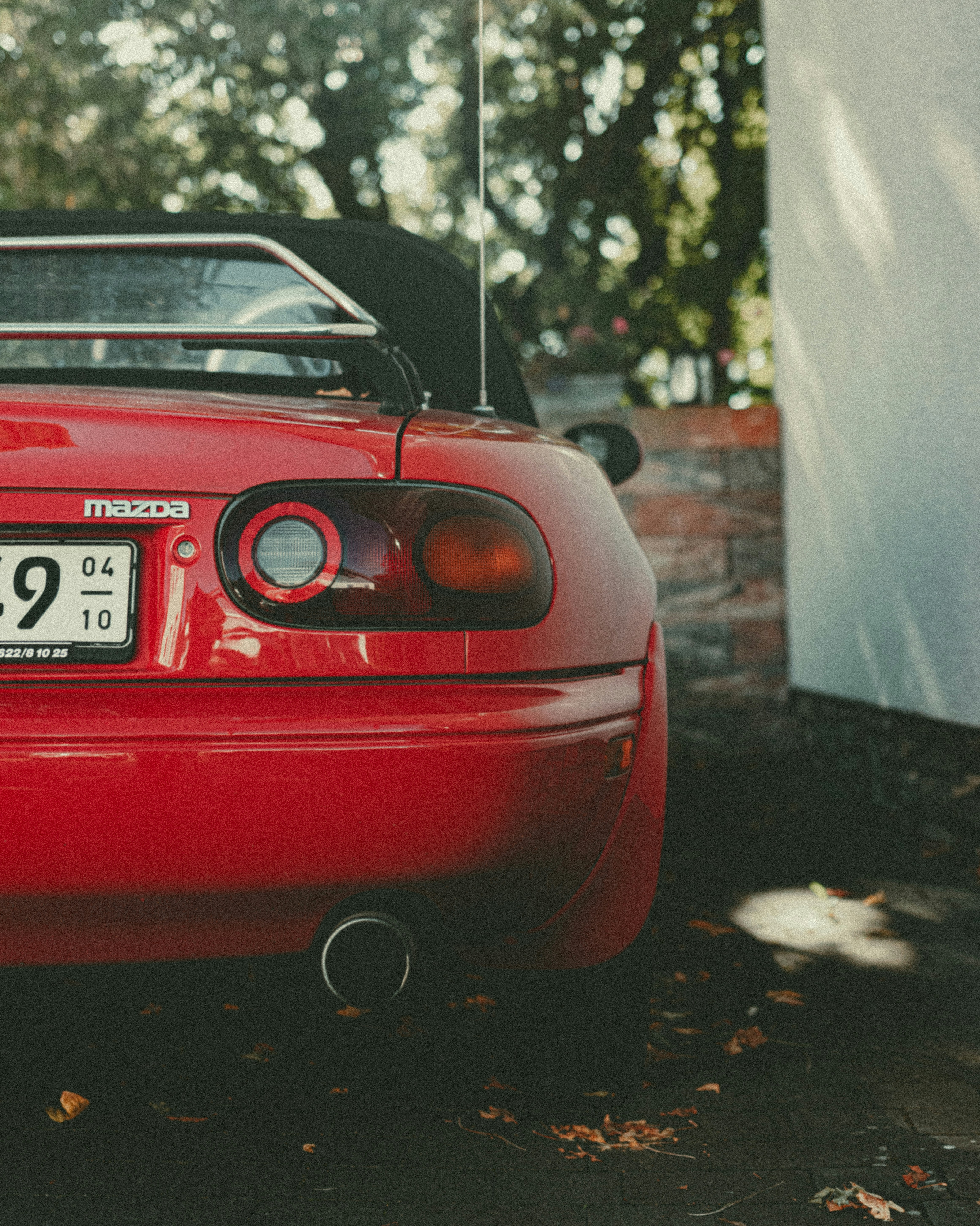 Red Mazda Rooftop Echo: The Car's Quiet Corner