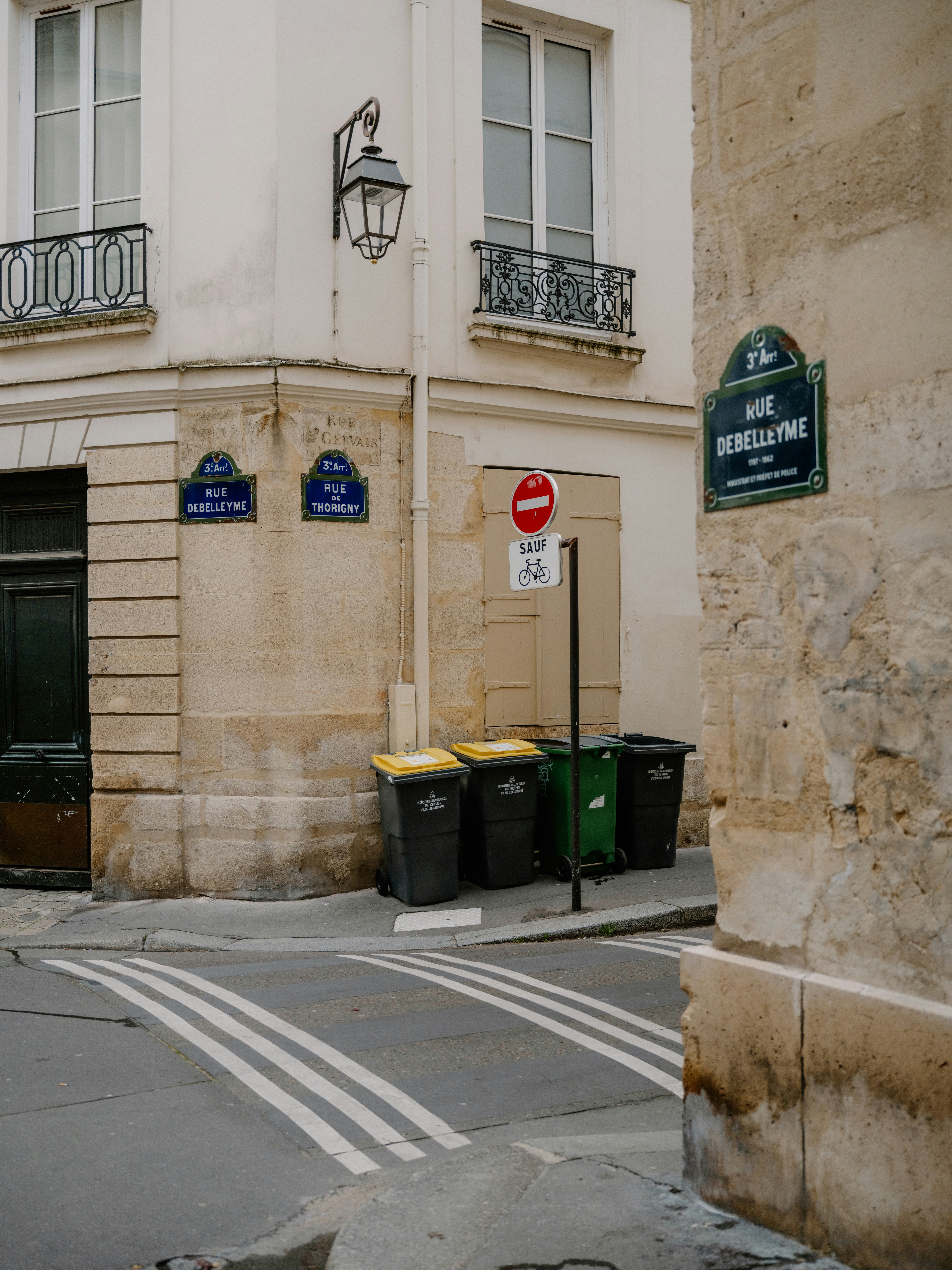 Corner of Quiet Rue: Trash Bins and Classic Facades