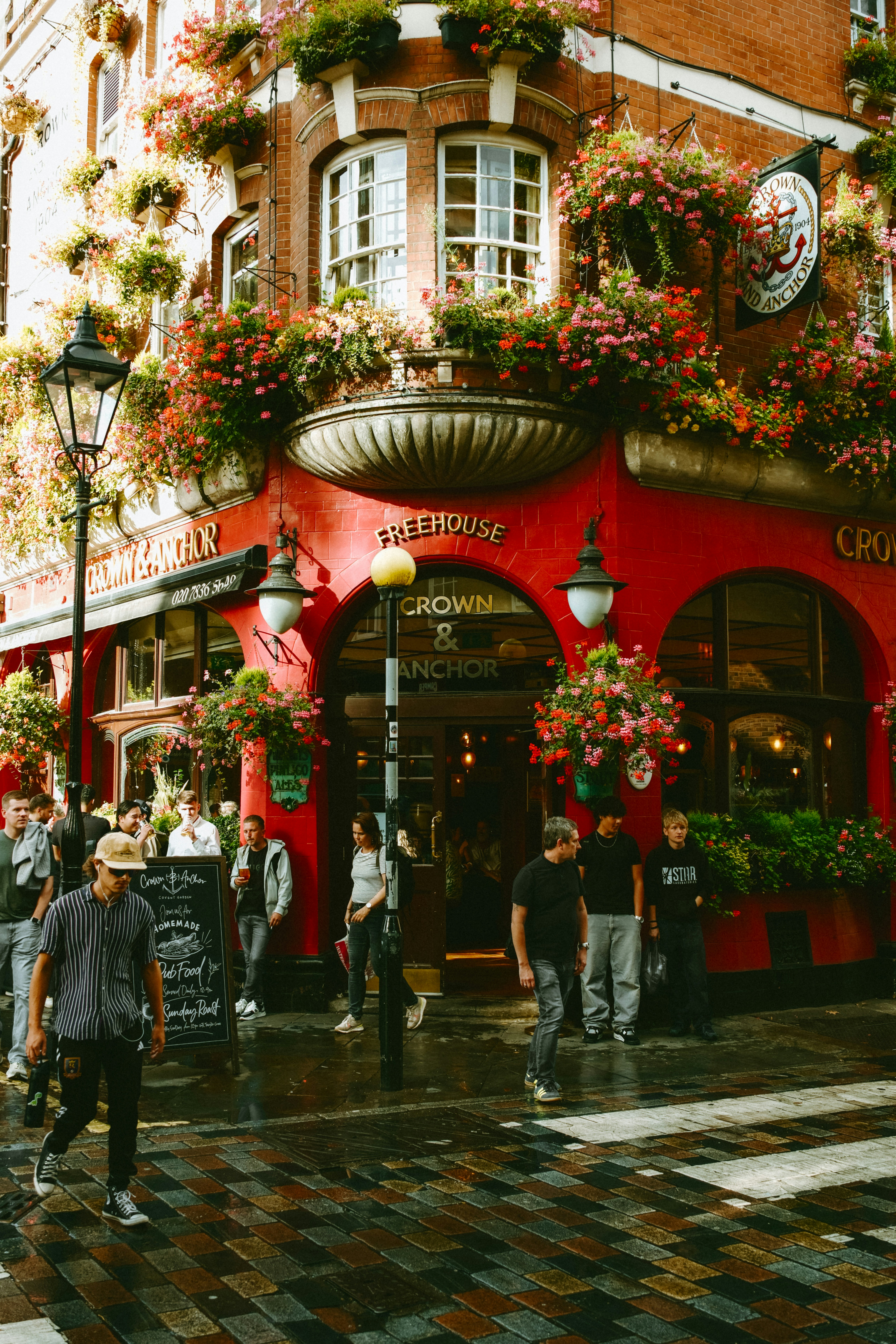 Red-Front Café on the Corner: A Lively Street Scene in Bloom