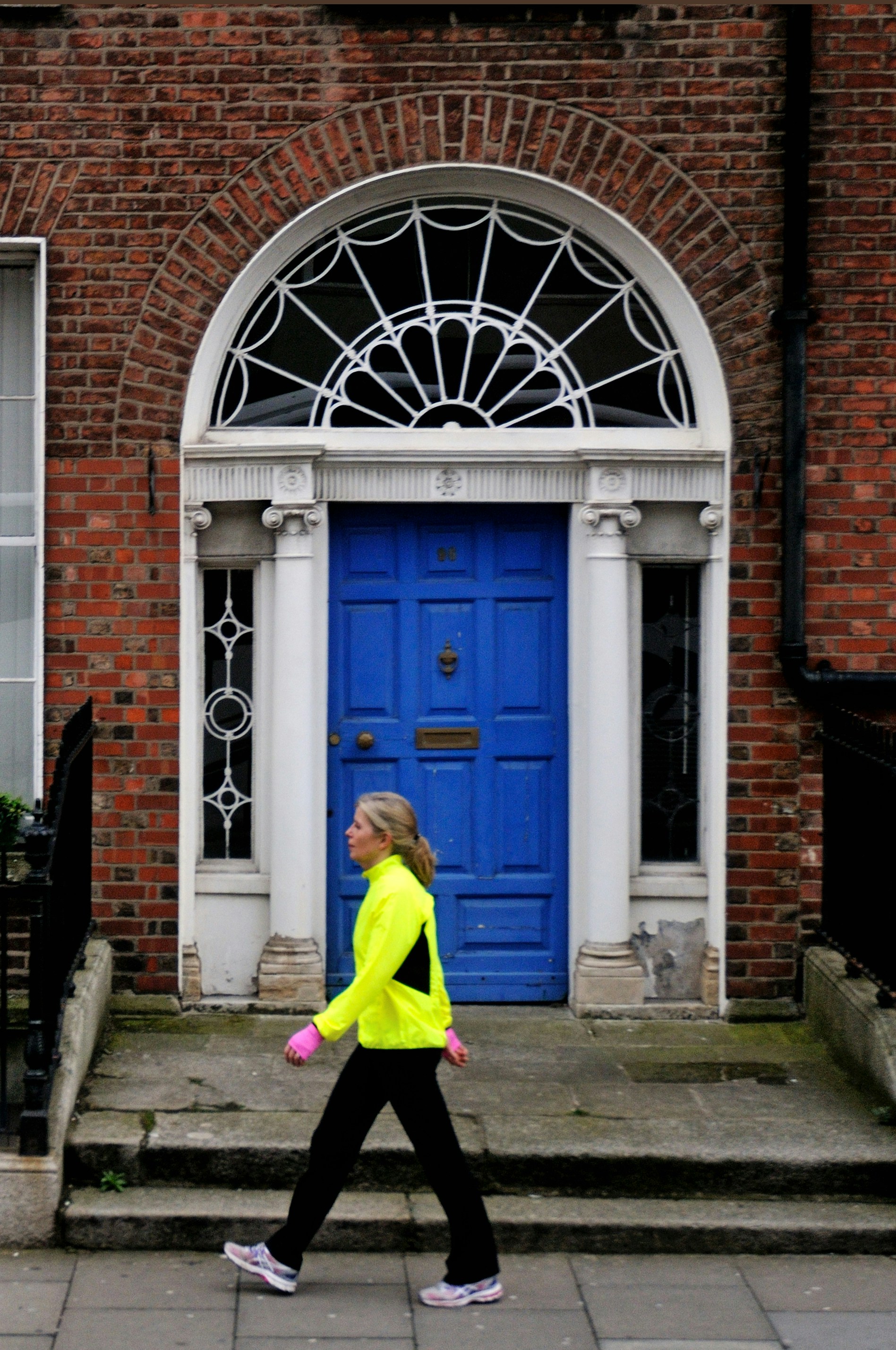 Bright Runner in Front of a Regal Blue Door