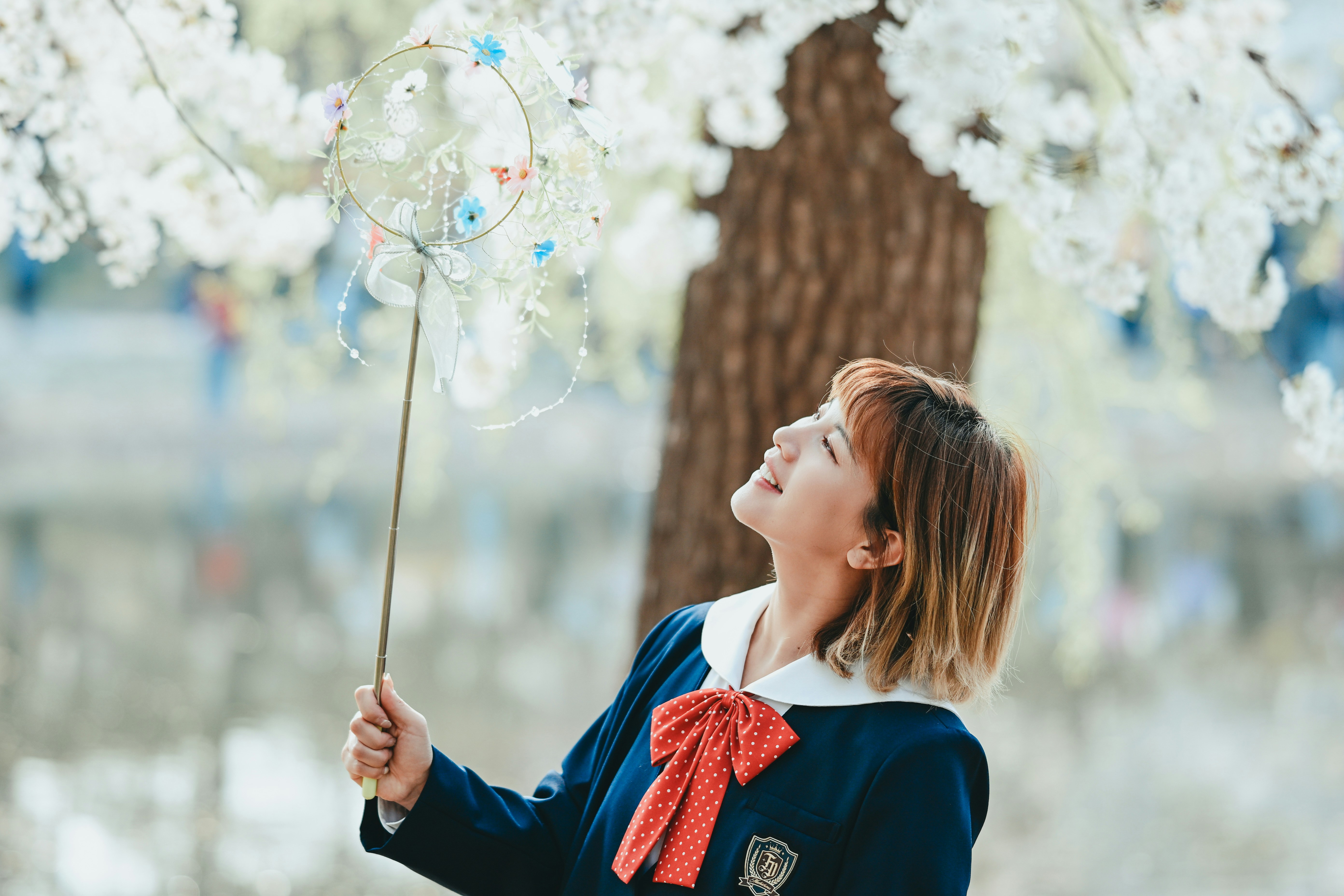 Blossoms and Breeze: A Quiet Moment with a Schoolgirl and a Wandering Windmill