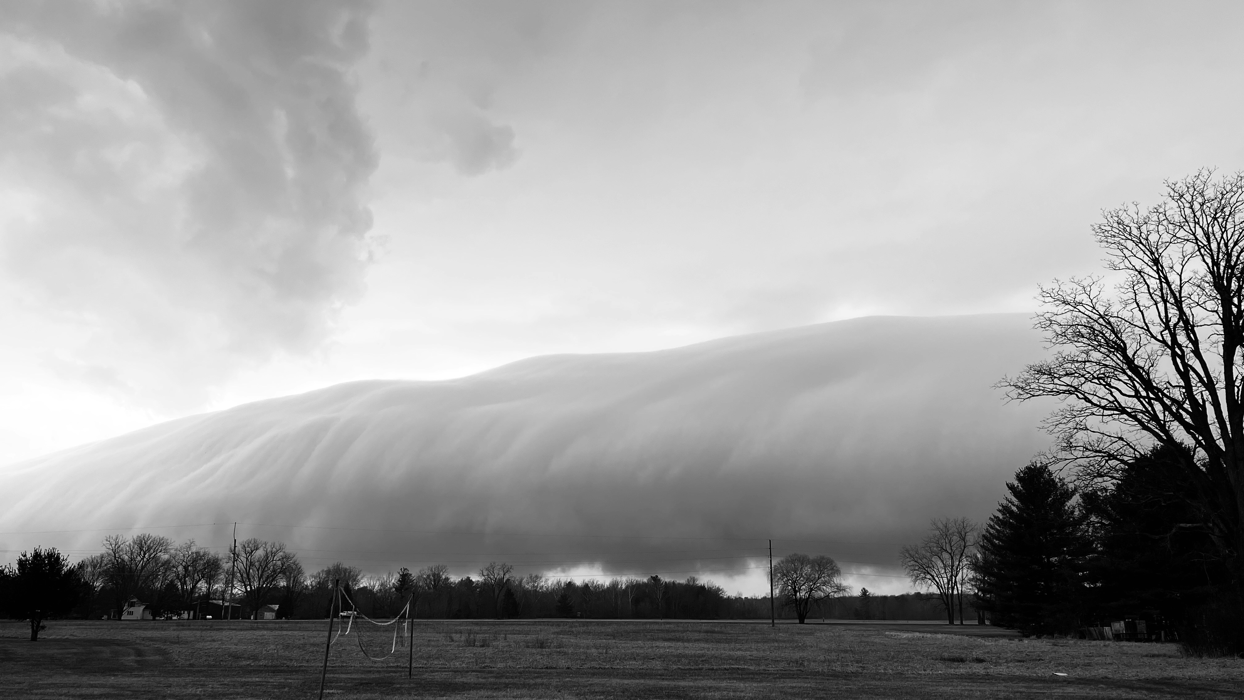 Low Horizon, Enigmatic Cloud Ribbon Over a Quiet Field