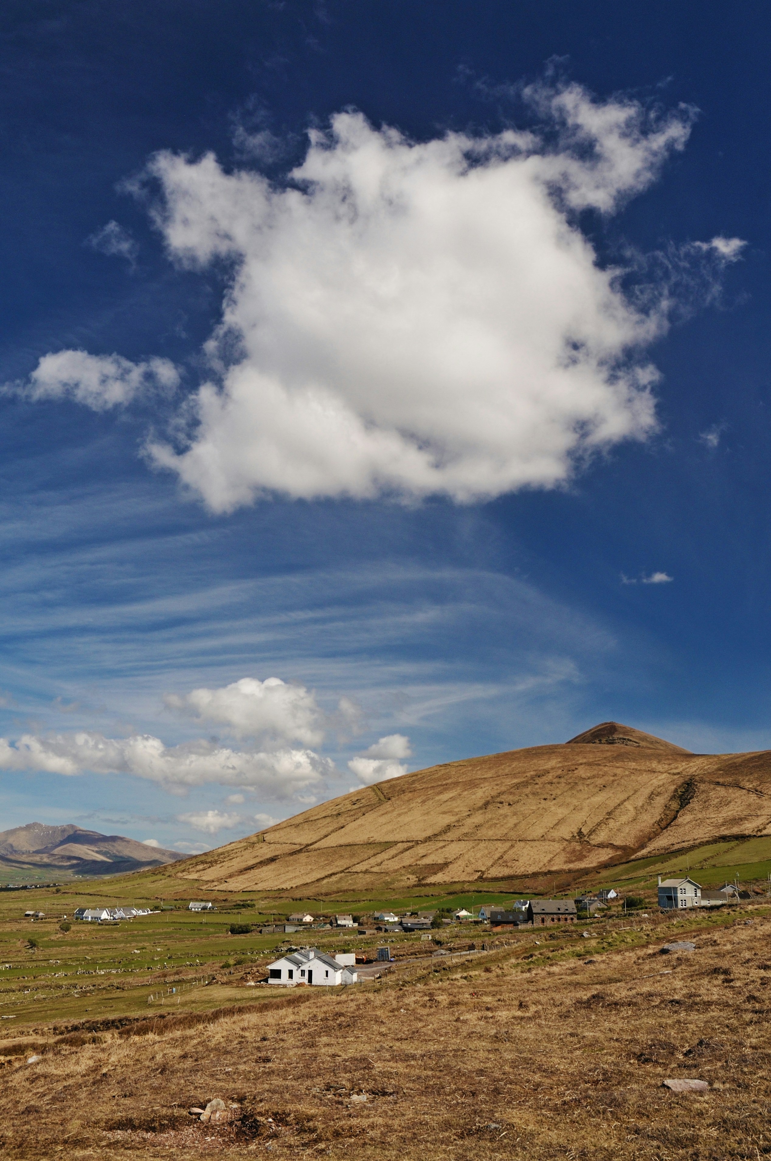 Hillscape under a solitary cloud