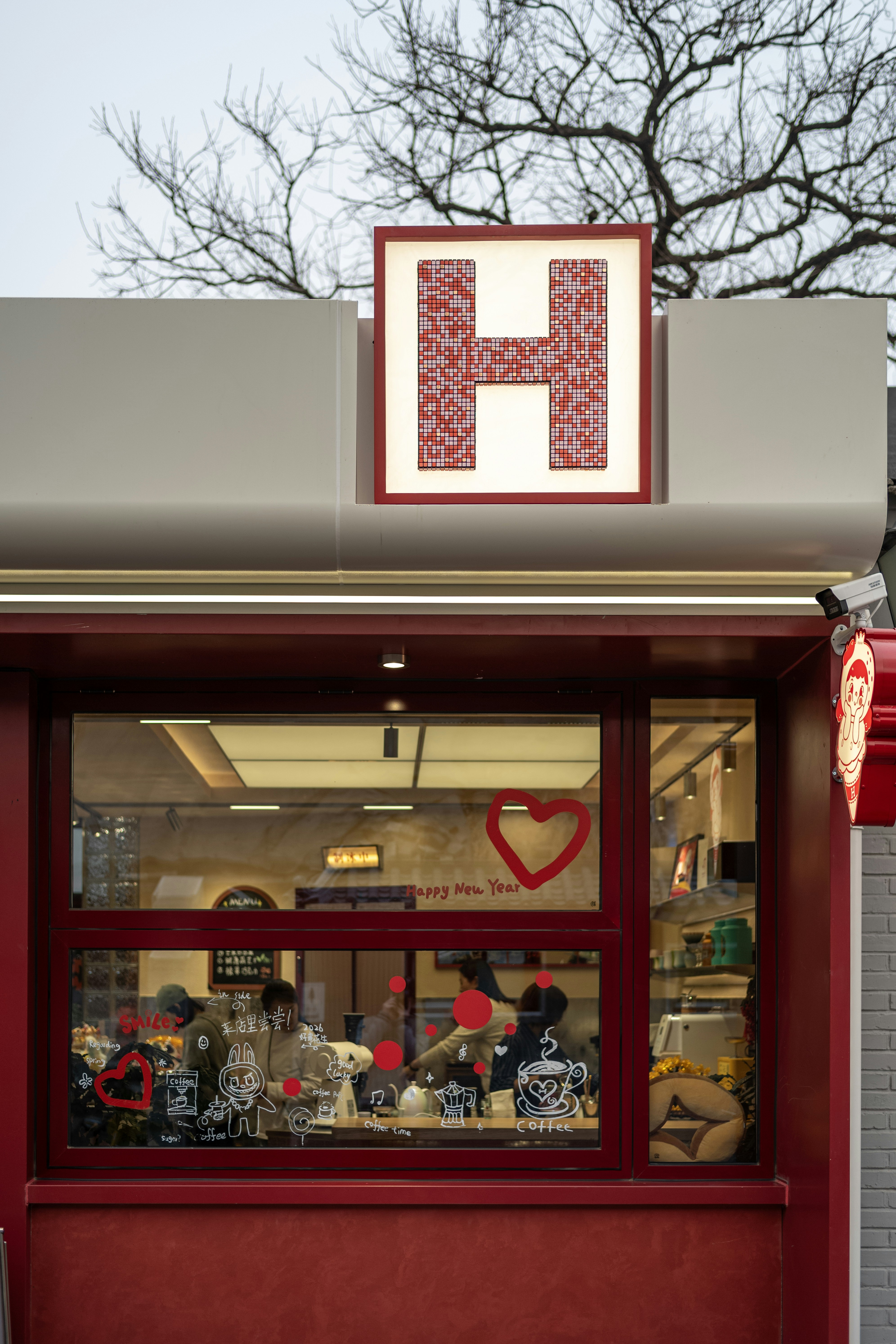 Heart and steam: a cozy cafe storefront under a glowing sign