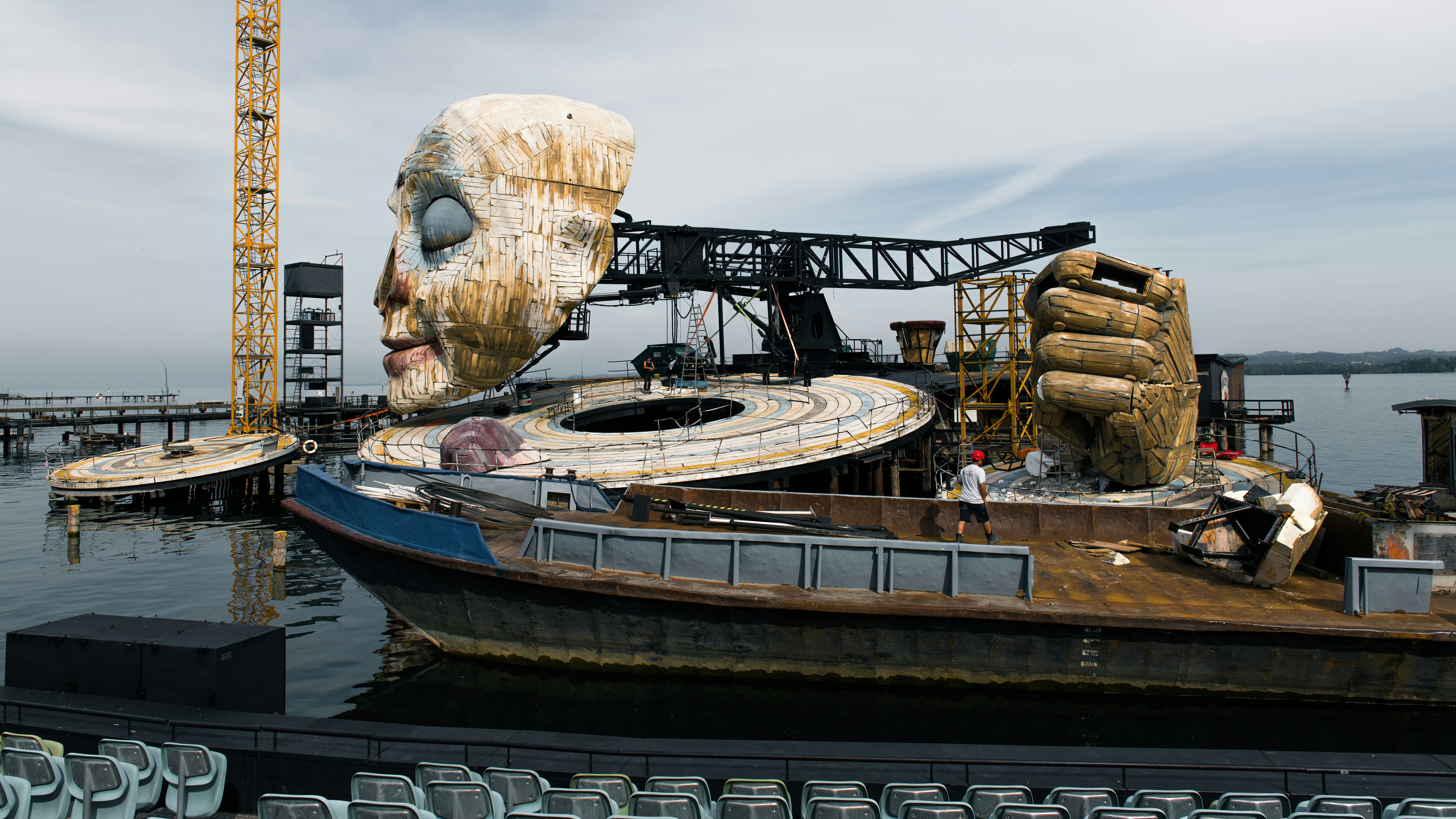 Giant Puppet Heads Rise from the Water: A Dramatized Dockside Installation