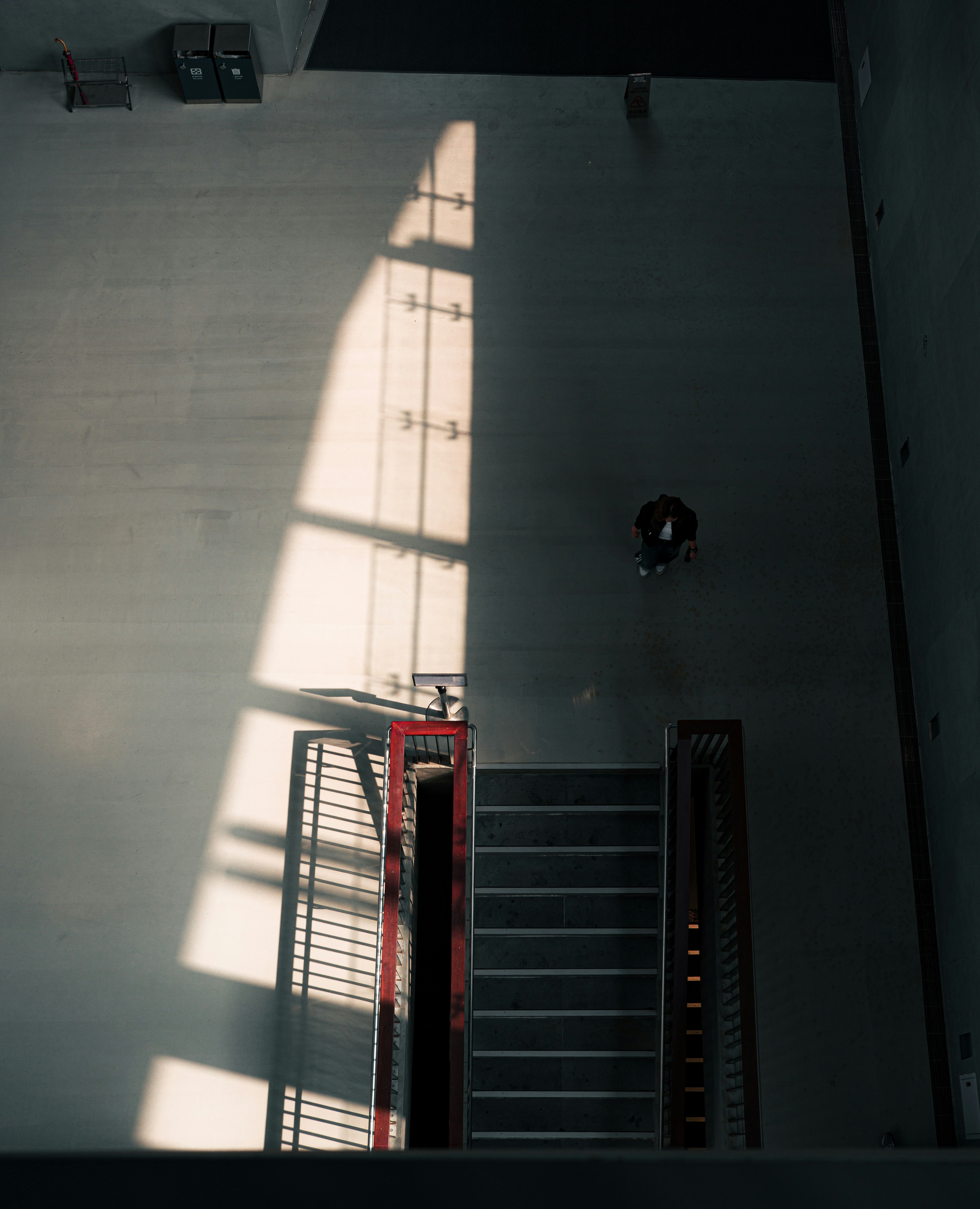 Shadowed Stairwell: Geometry of Light and Pause