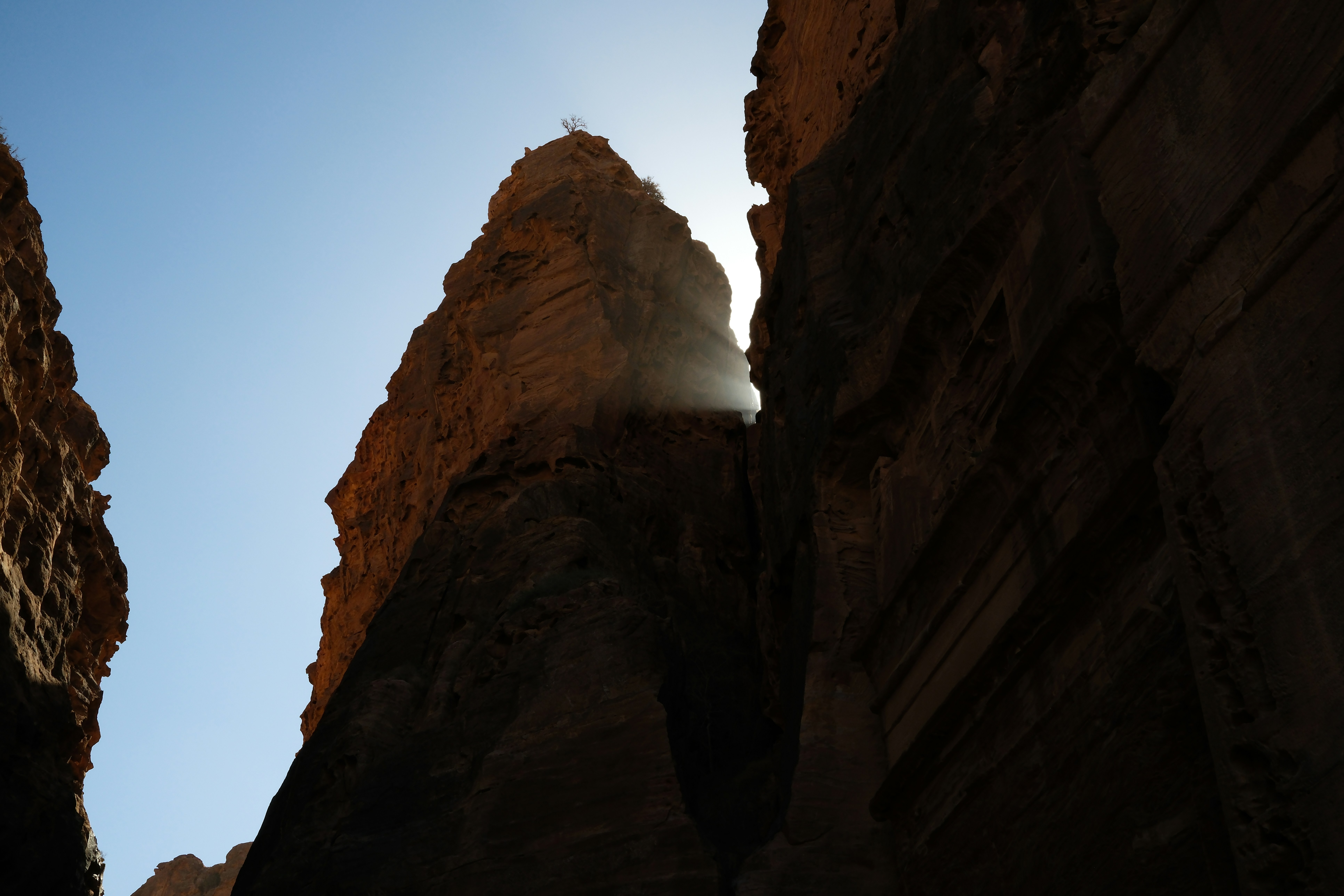 Sunlit Spire Between Shadowed Walls