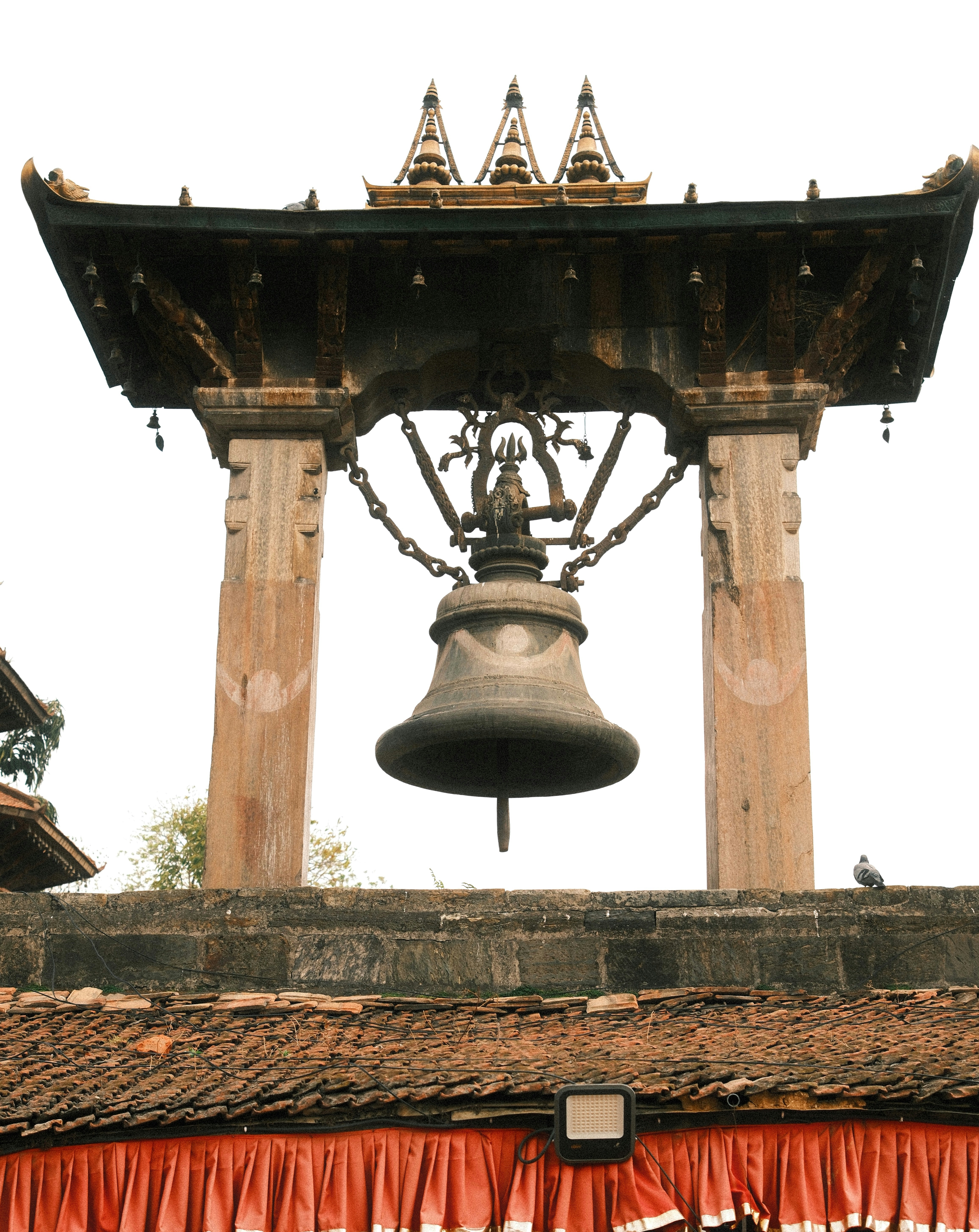 Ancient Bell under a Timbered Shrine Arch