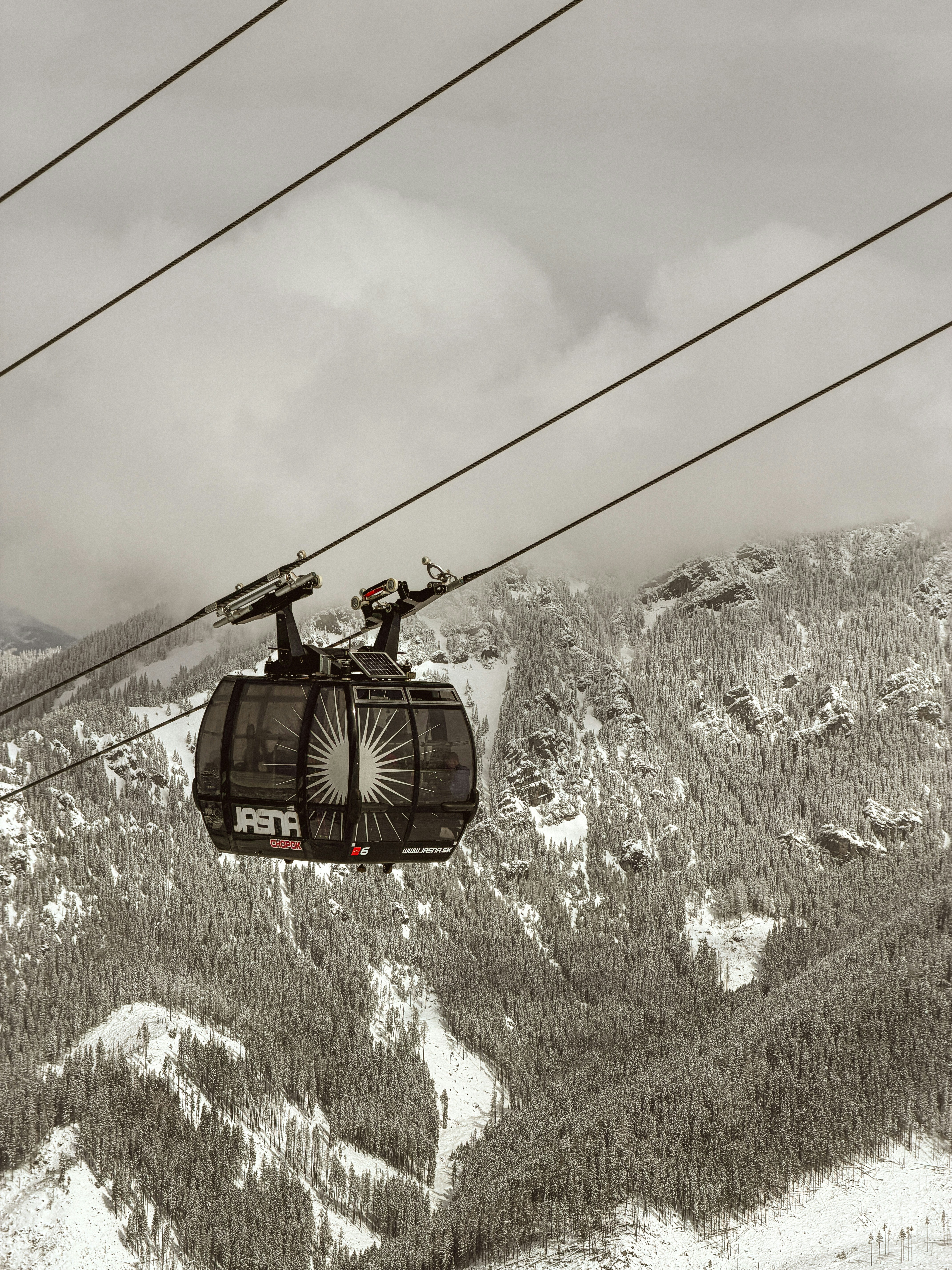 Cable Car Descent through Alpine Snow