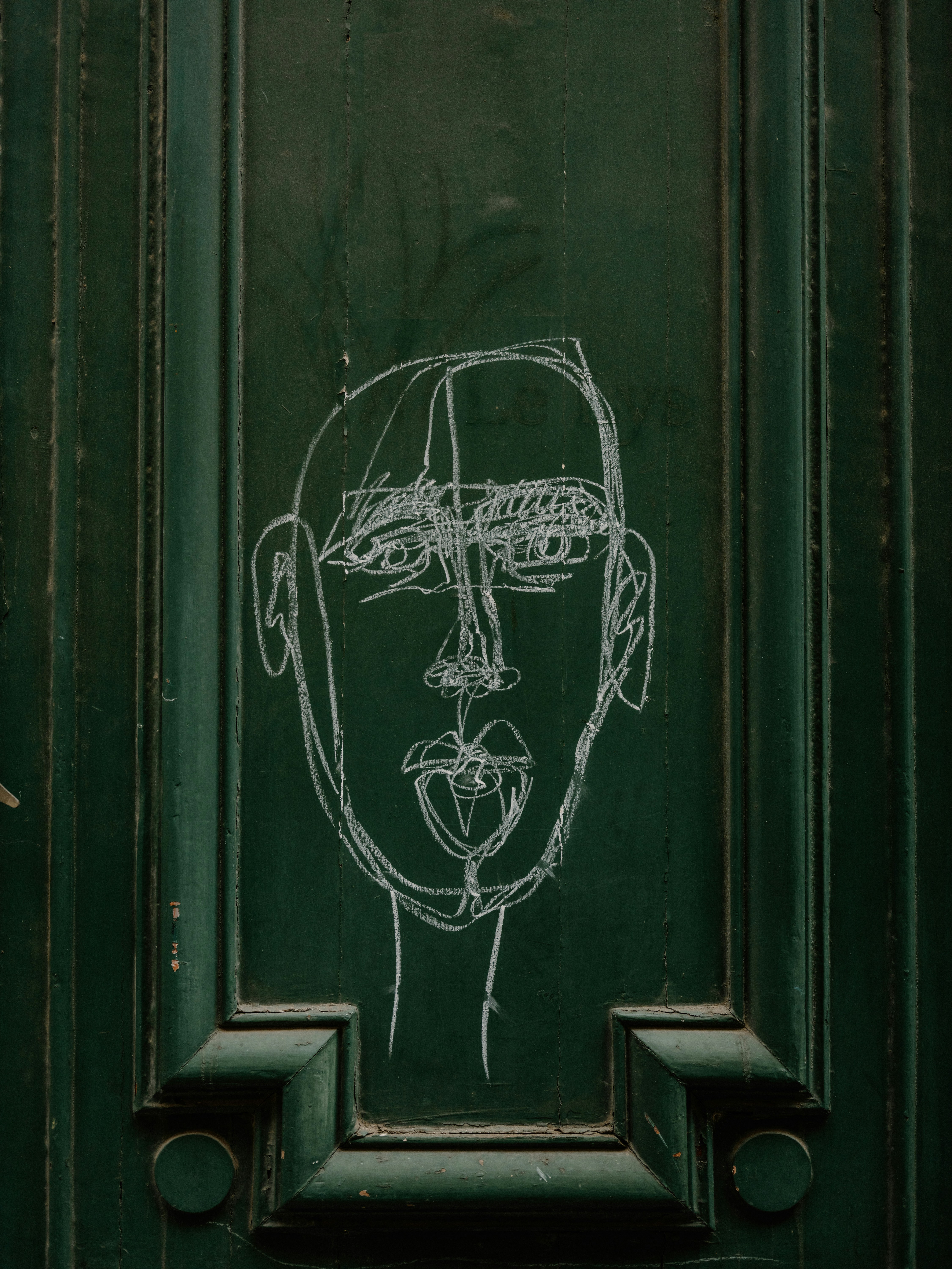Chalked Persona on a Dark Door