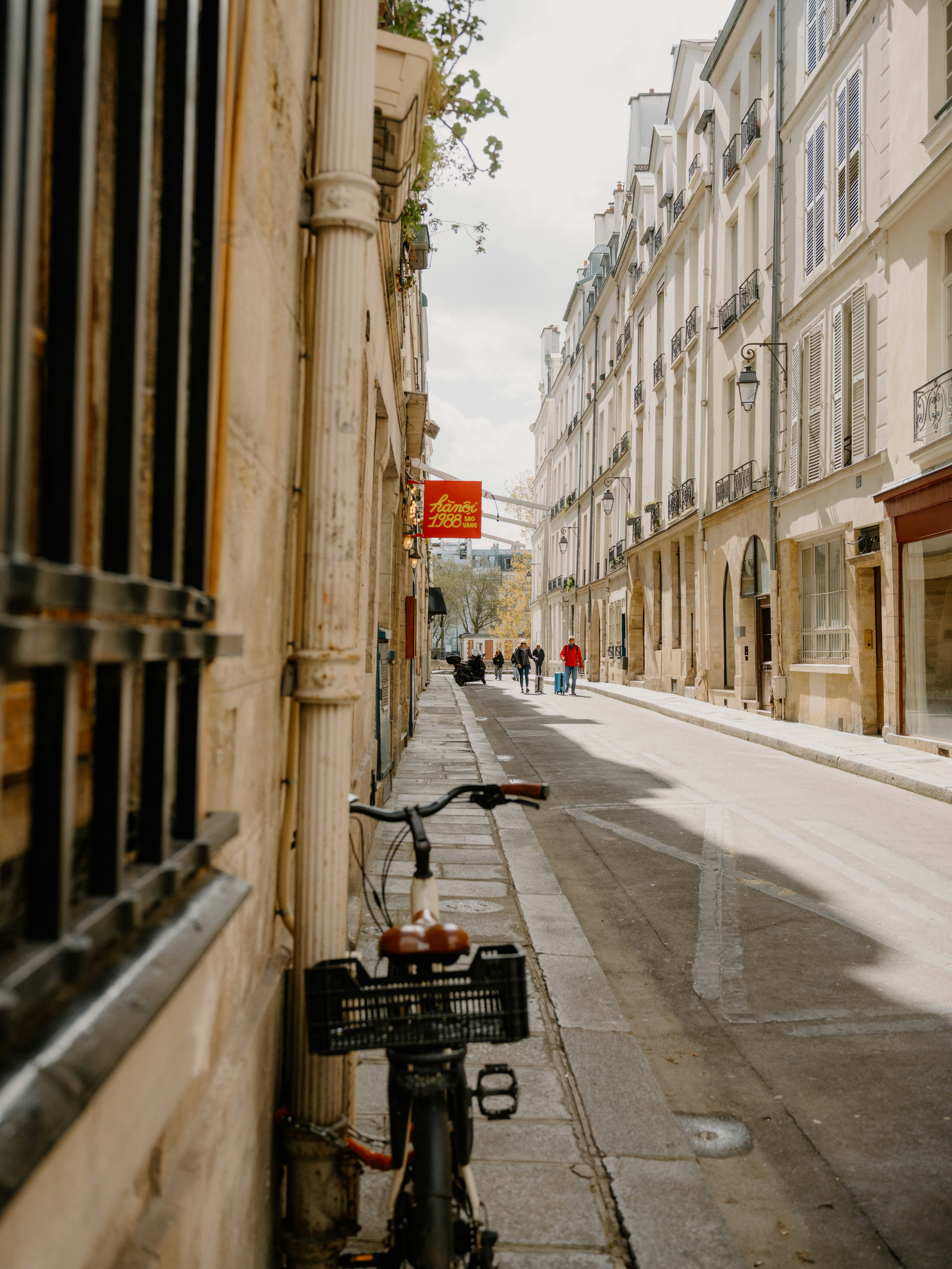 Bicycle Frame, Sunlit Rue in a Quiet European Street