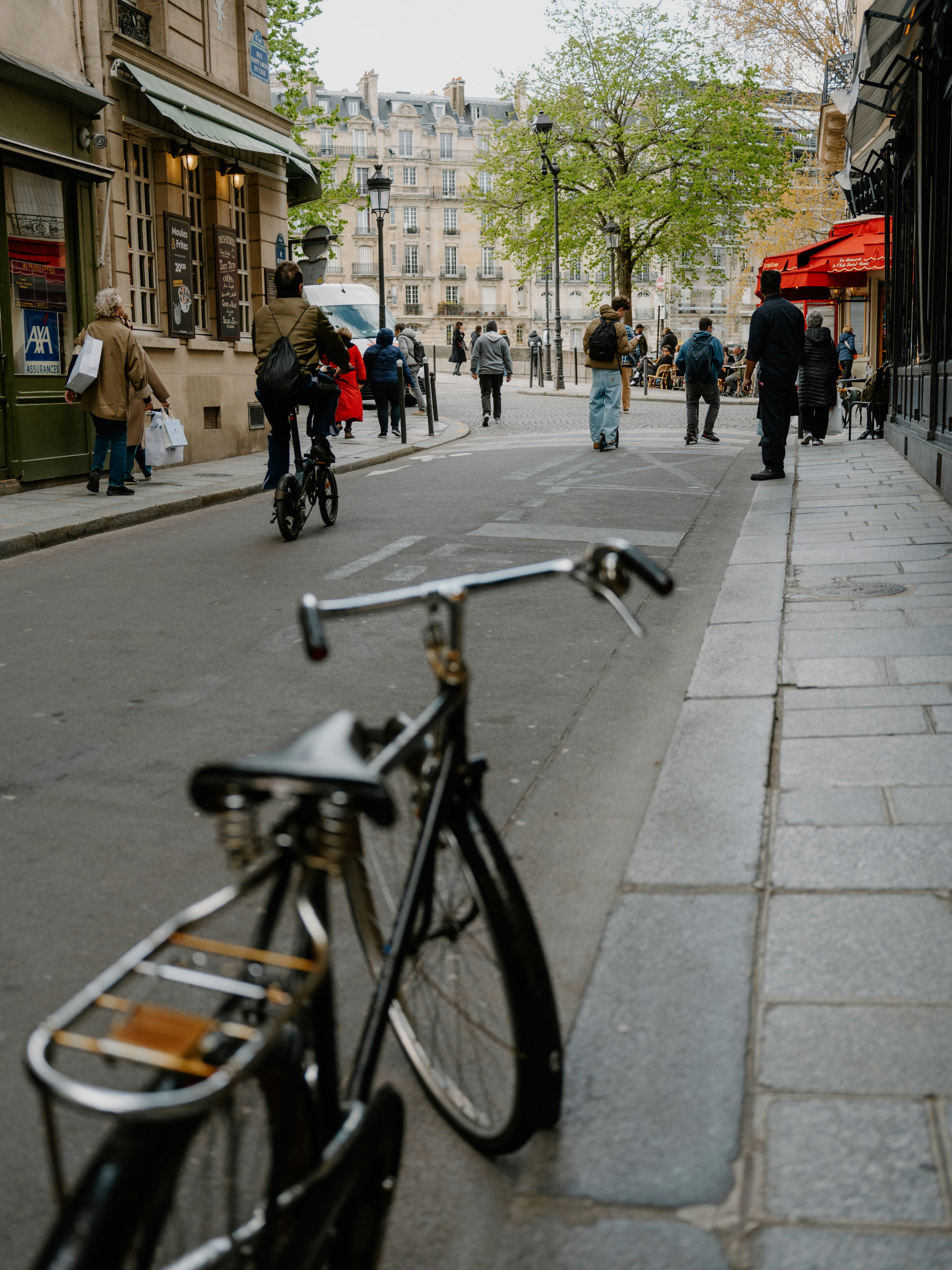 Toward the Corner Café: A Quiet City Moment with a Foreground Bicycle
