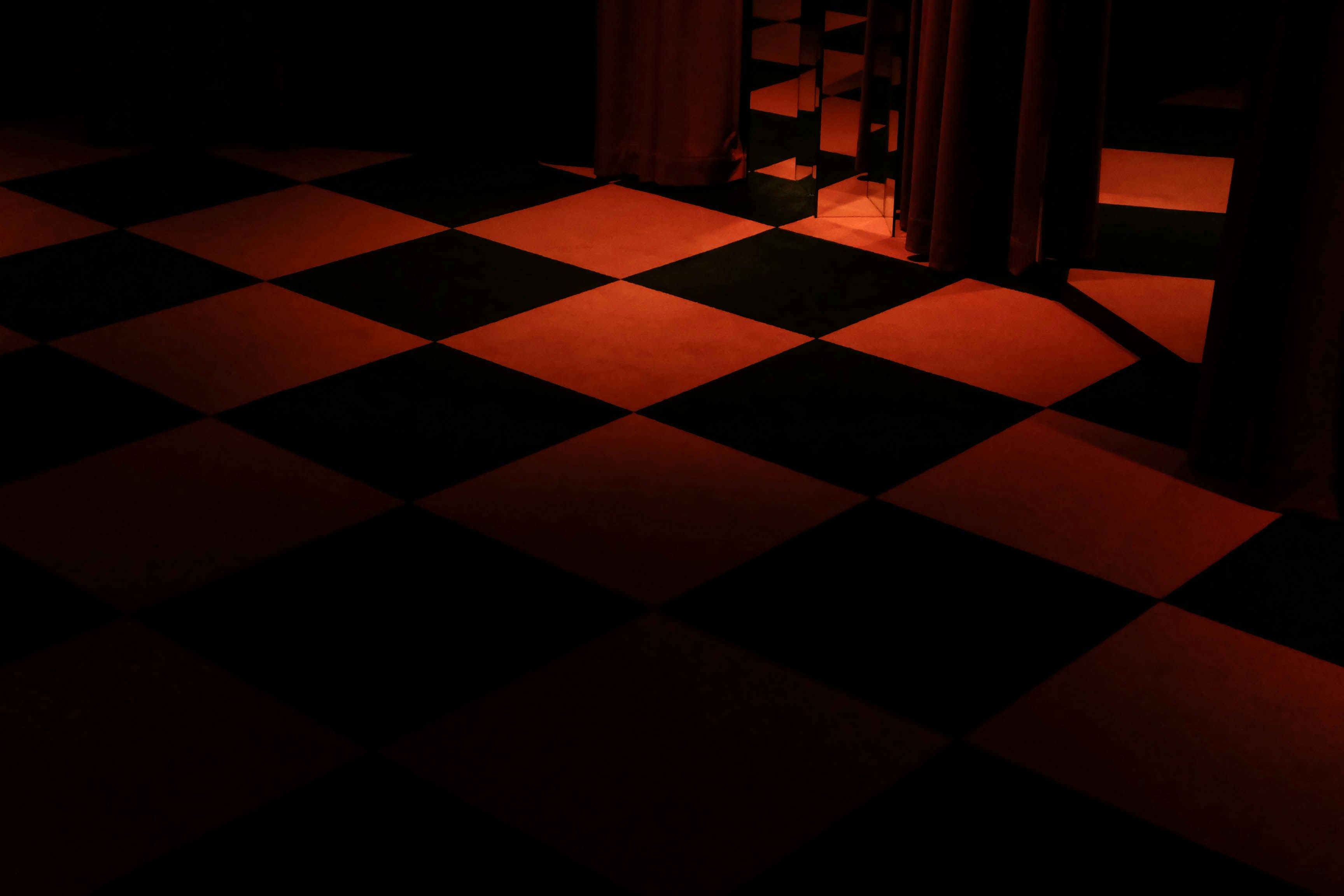 Dim Checkerboard Stage with Edge of Lighted Entrance
