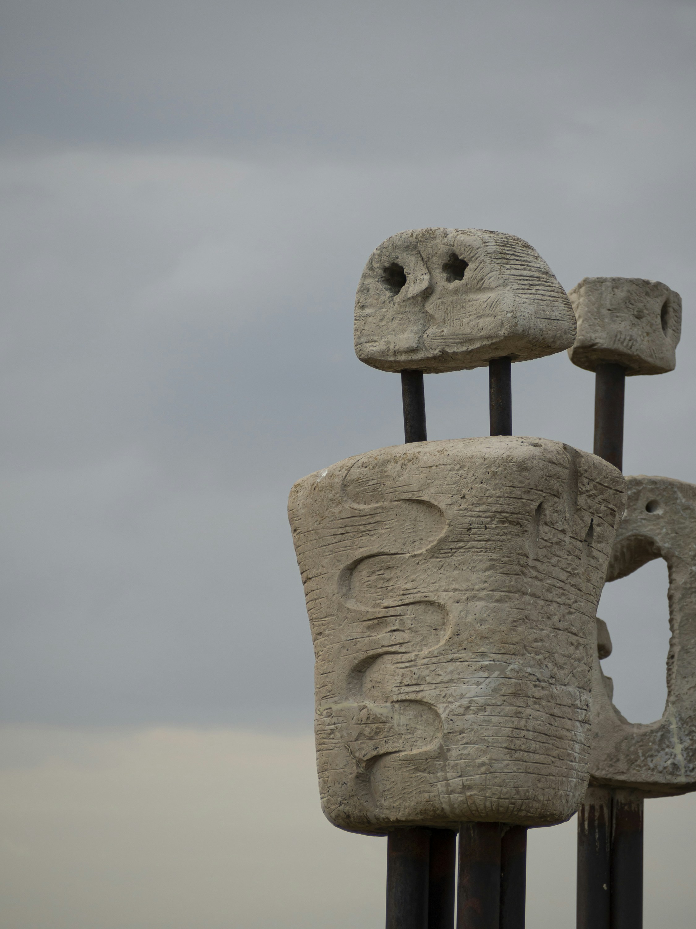 Stone Monoliths: Humble Faces in an Open Sky