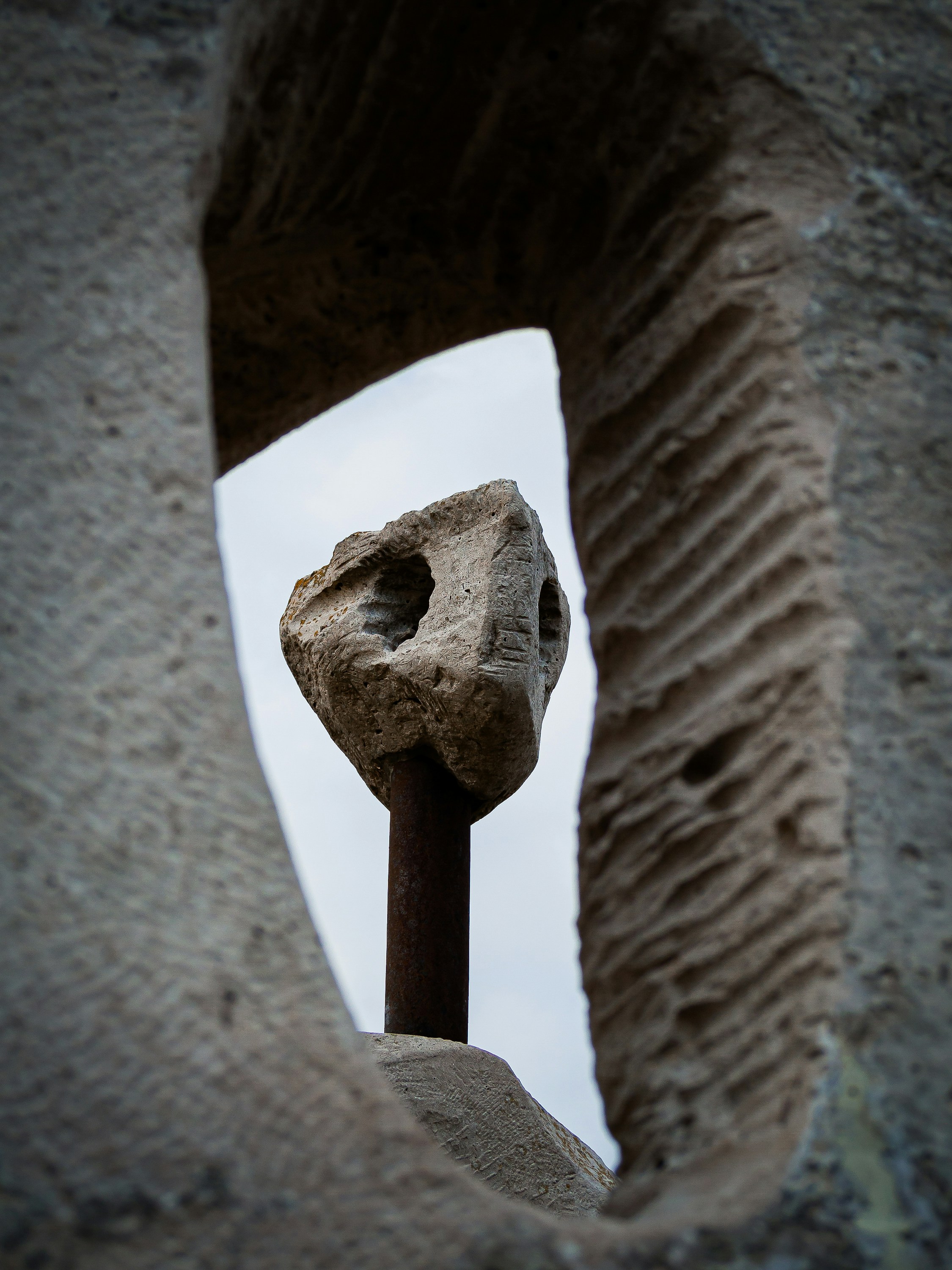 Stone Hammer Ringed by Erosion: A Close-Frame Study of Weathered Sculpture