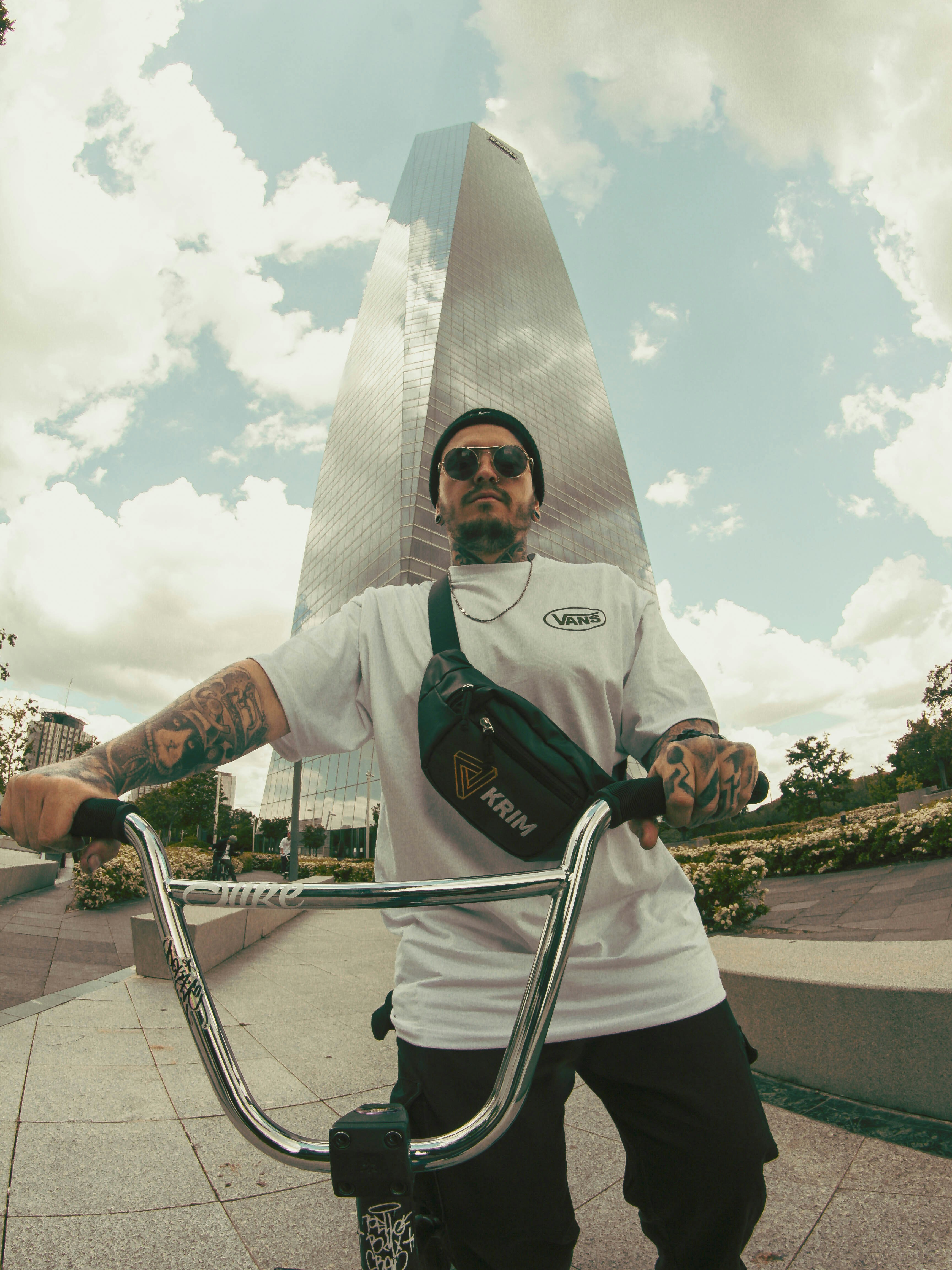 Urban Rider Before a Glassy Tower