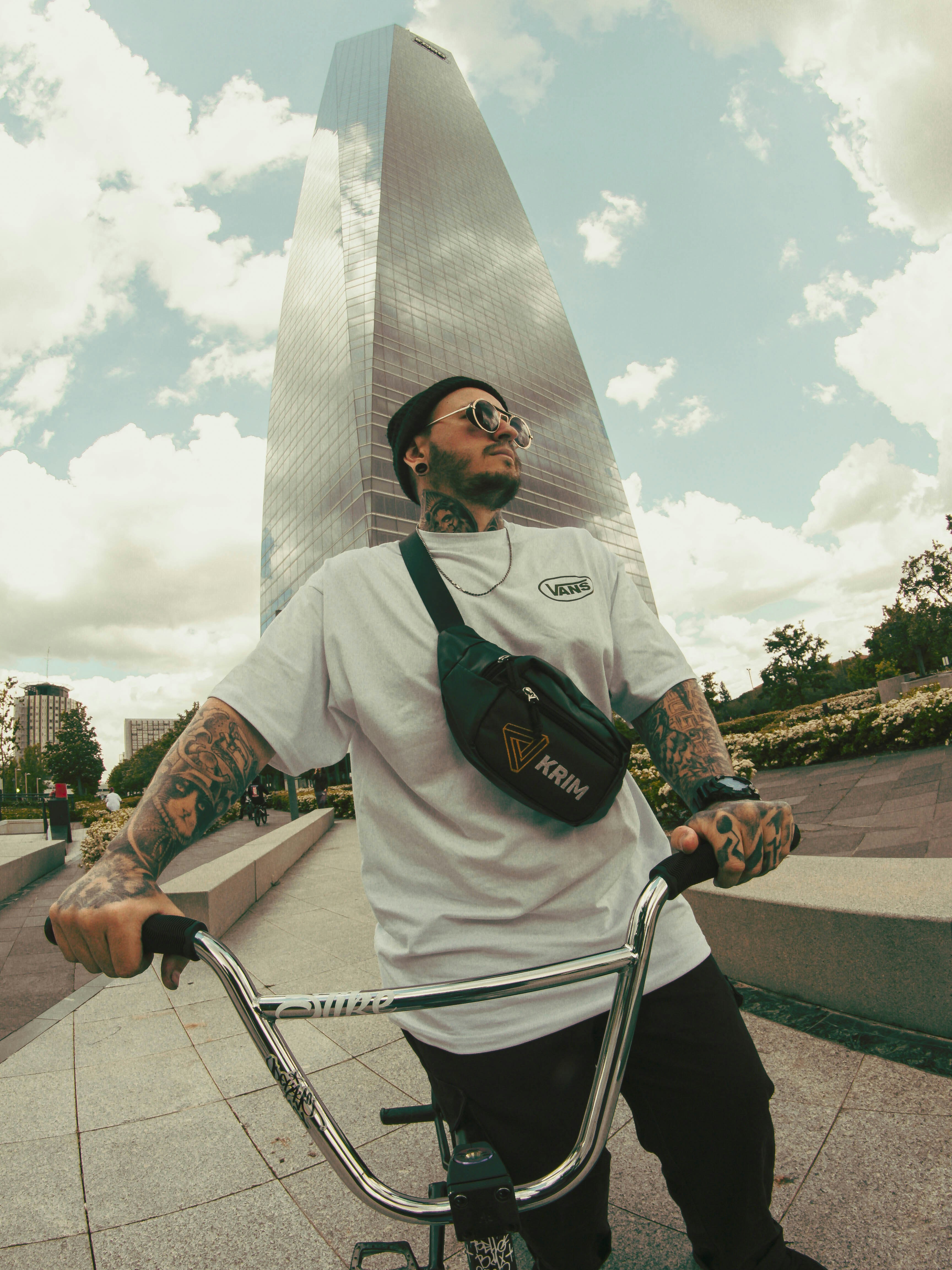 Urban Glide: Portrait of a Rider Below a Skyscraper