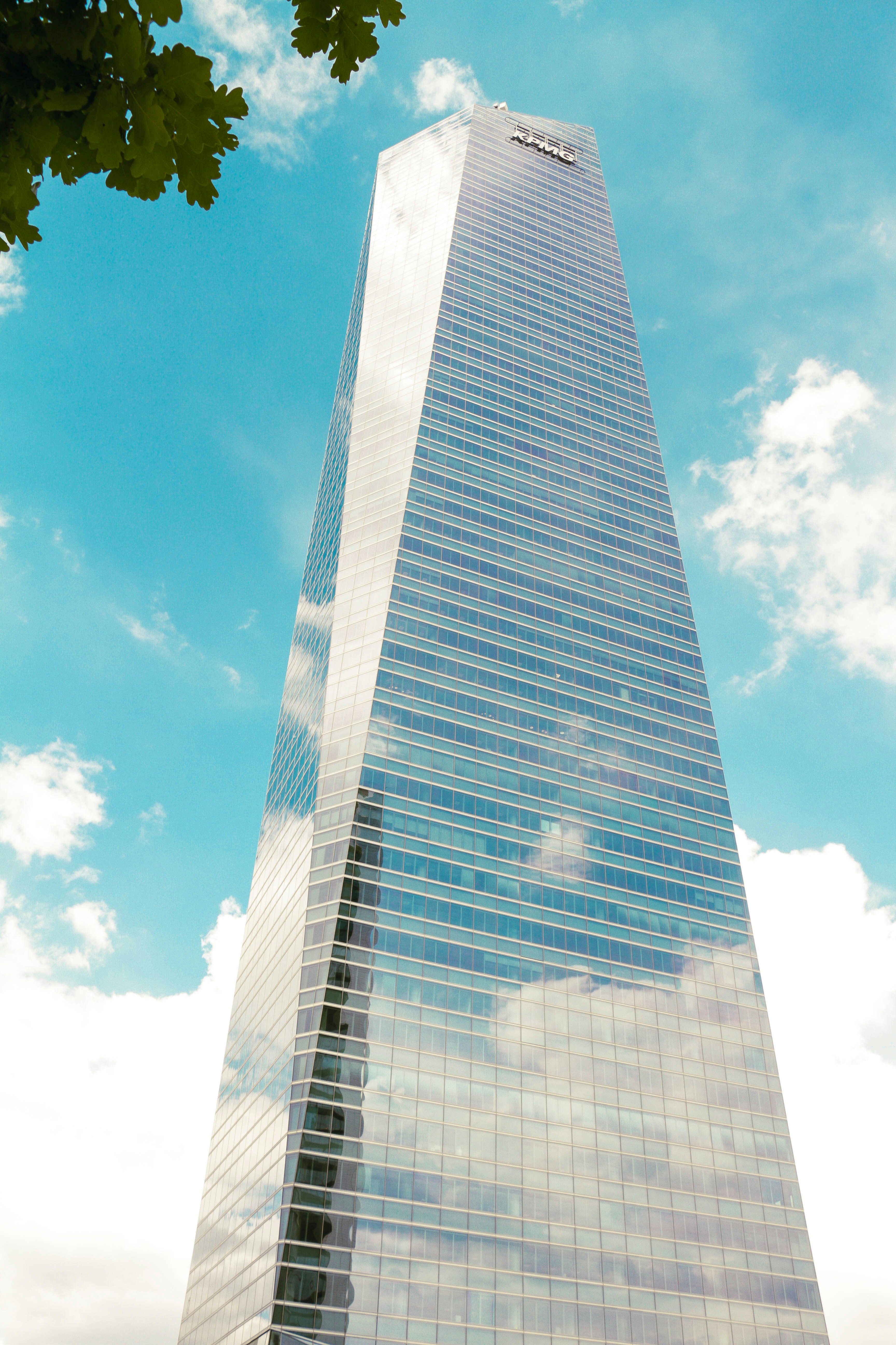 Skyward Reflection: A Glass Tower Reaching the Sky