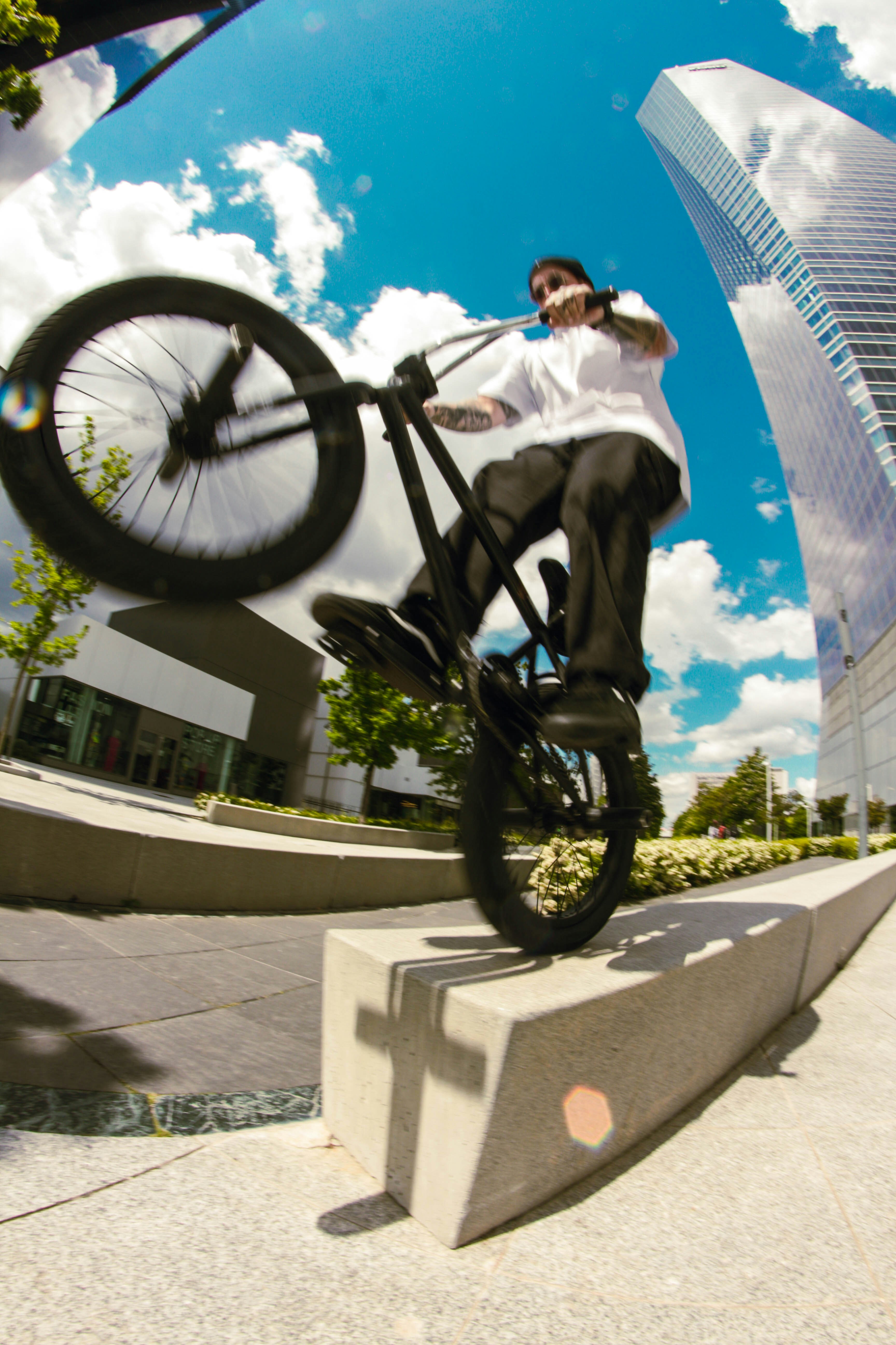 Urban BMX Leap Under a Sky-Blue Canyon