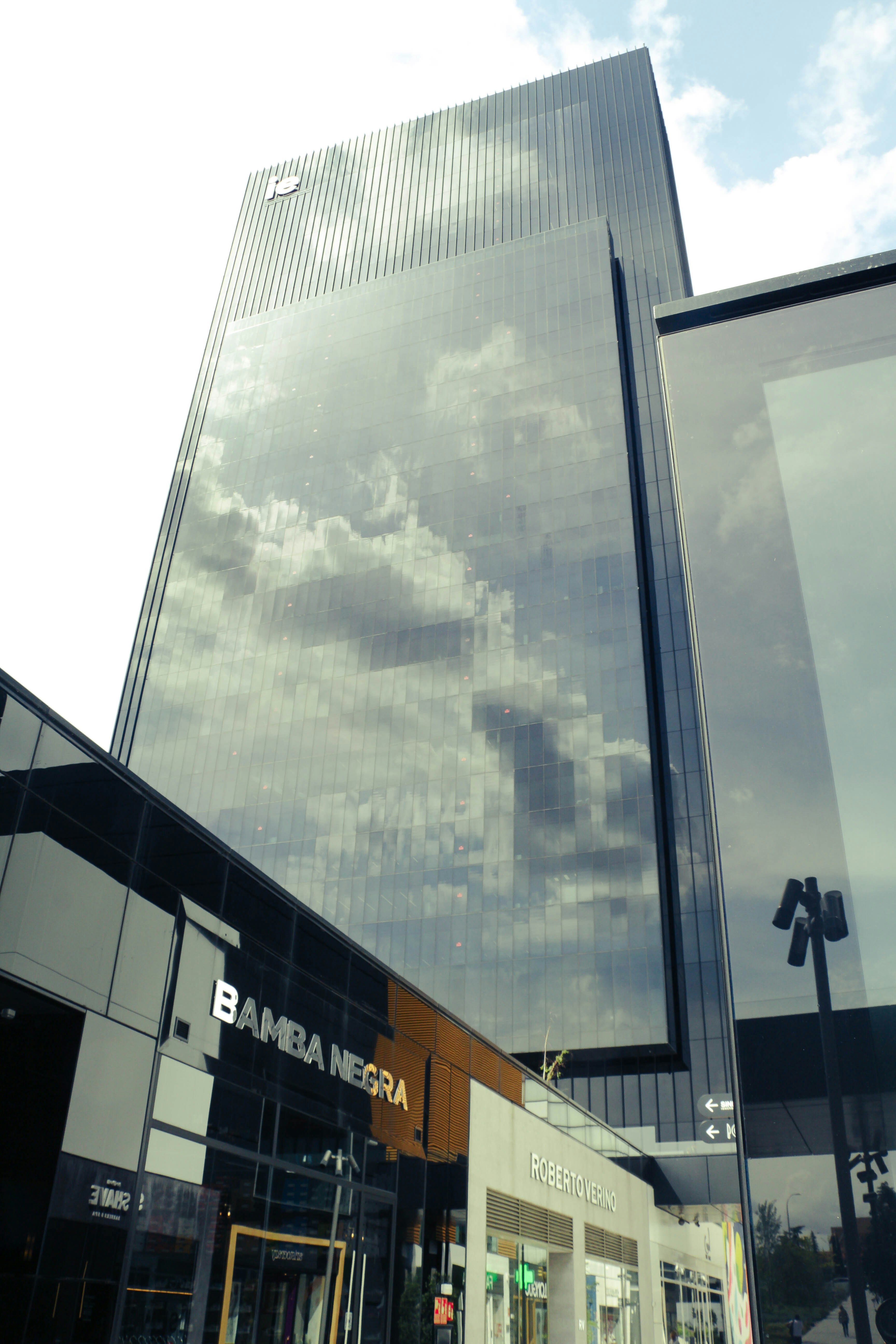 Glass Facade Rising: A City Block of Reflections and Retail