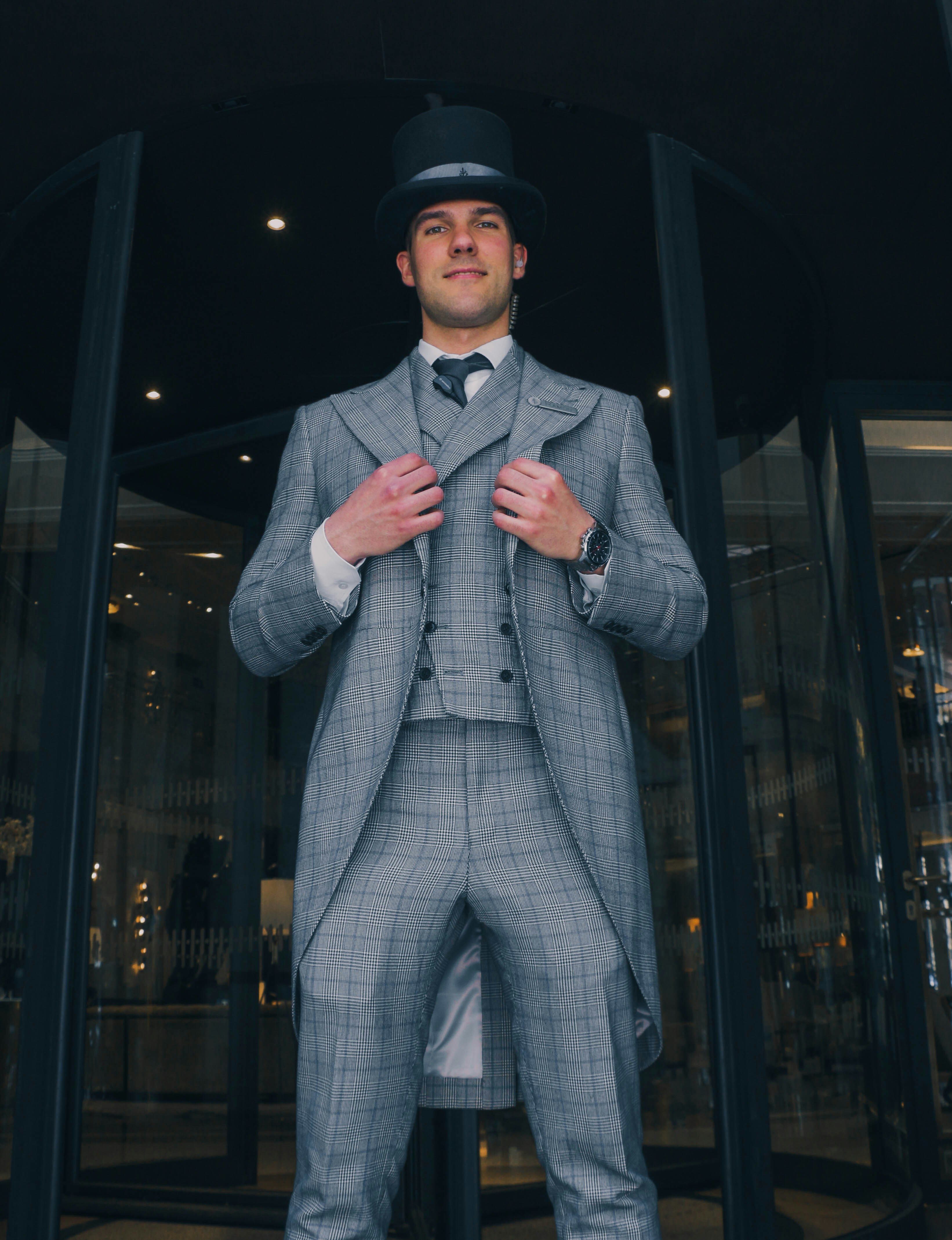 Gentleman’s Entrance: A Dapper Moment at the Doors