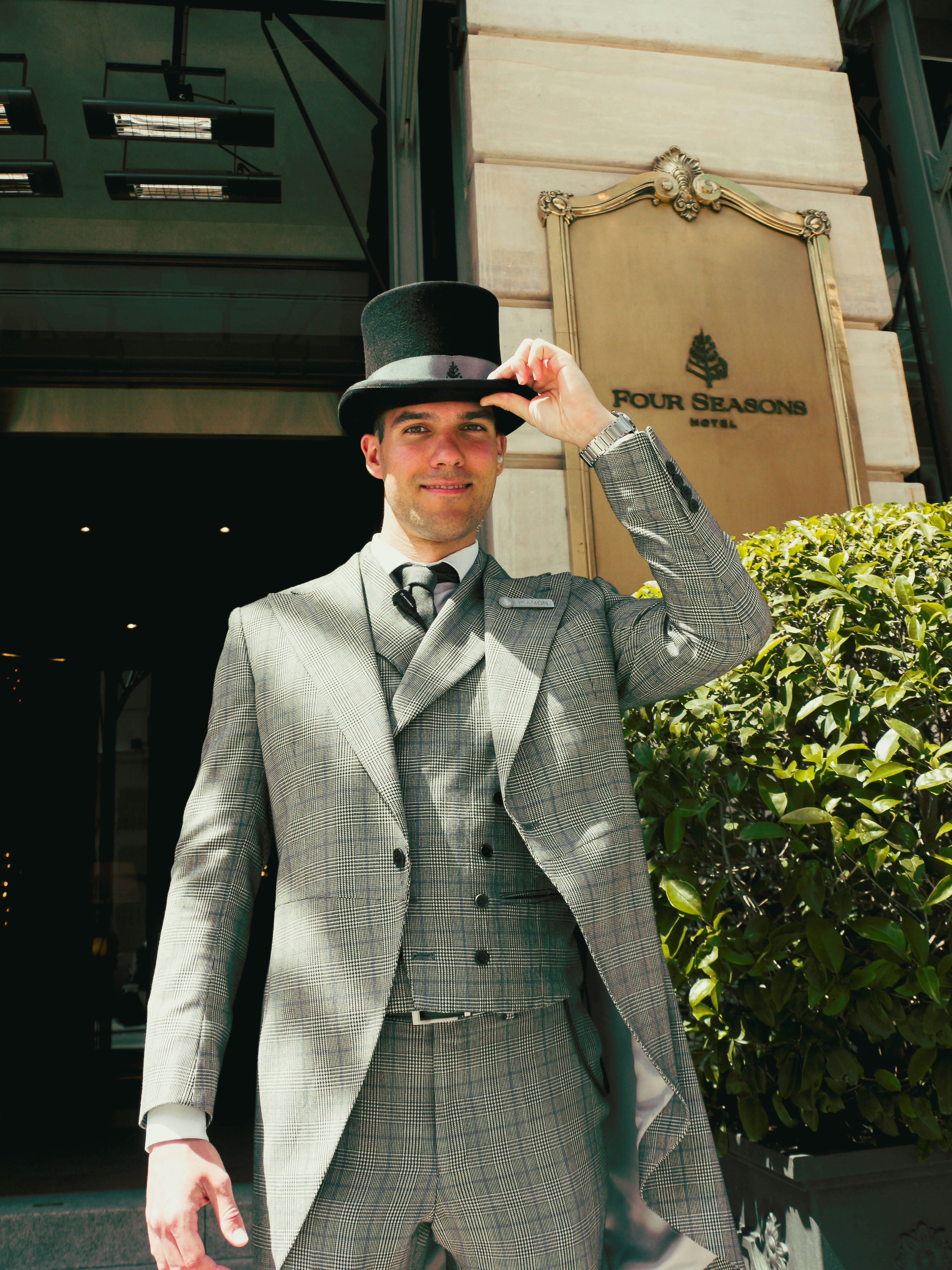 Gentleman in Classic Gray: A Top-Hat Moment at the Four Seasons