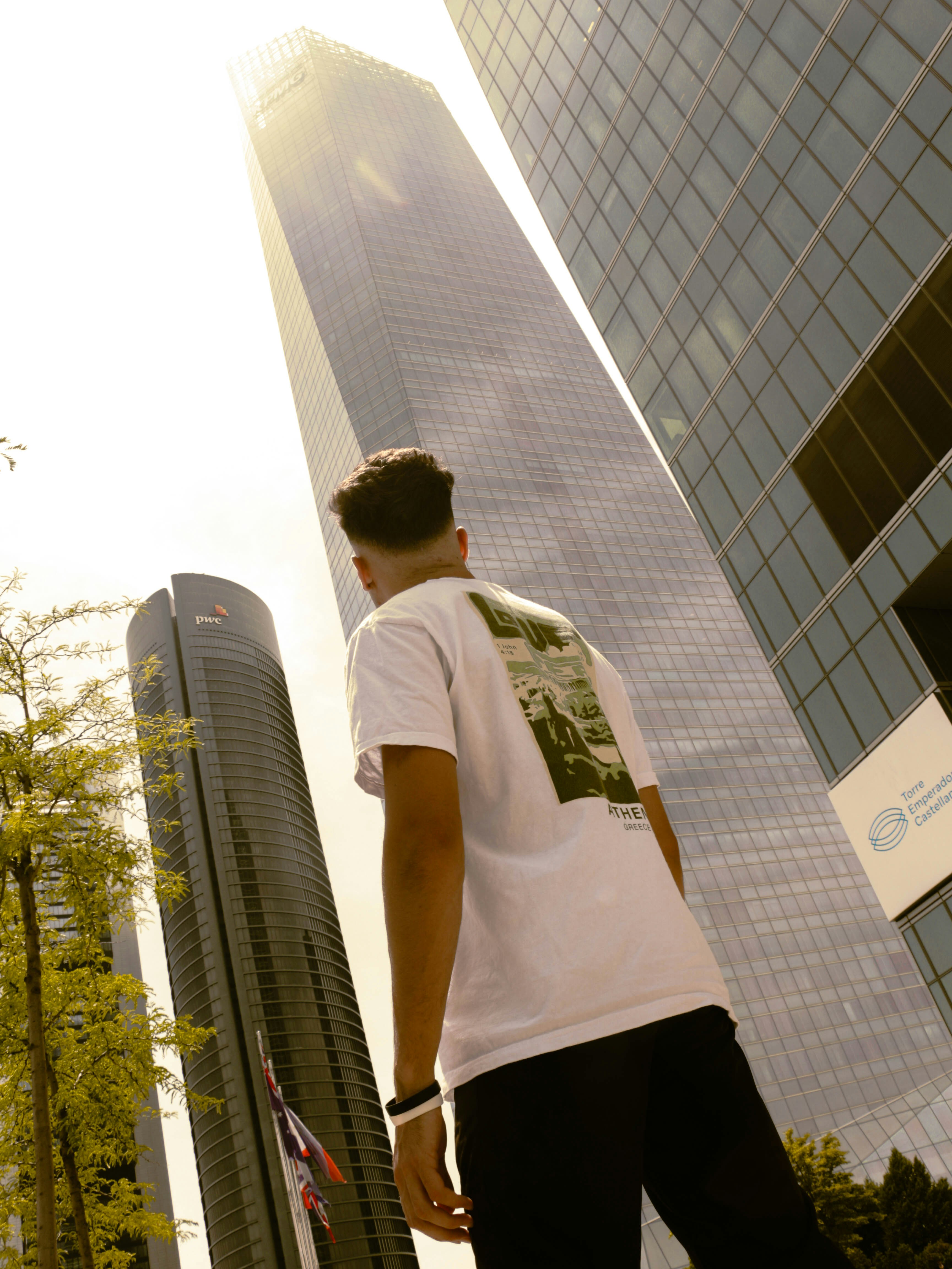 Urban Gaze: A Young Rider Steps Toward the Skyward Glass