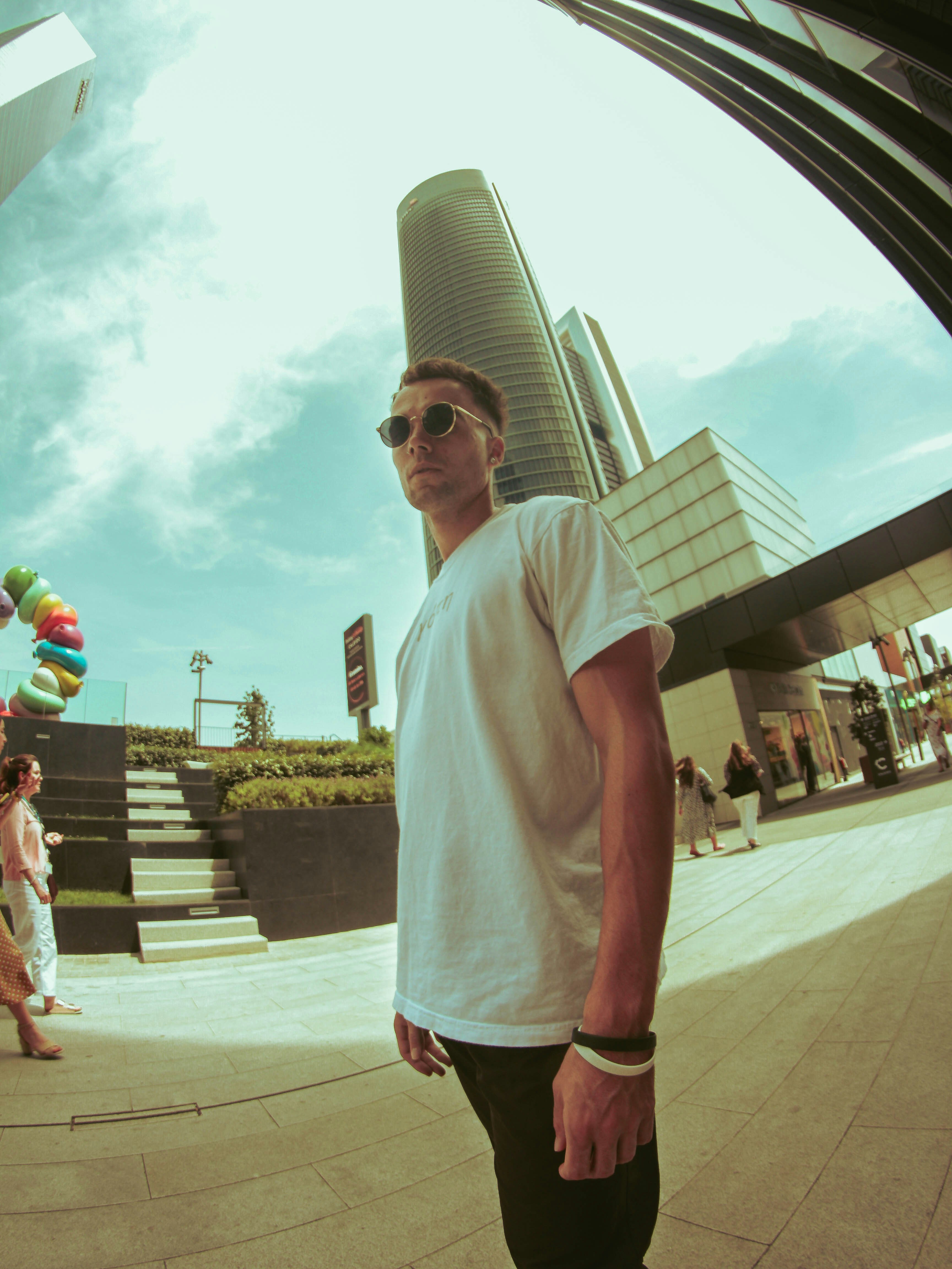 Tall Horizons: A Street Portrait Under Urban Skies